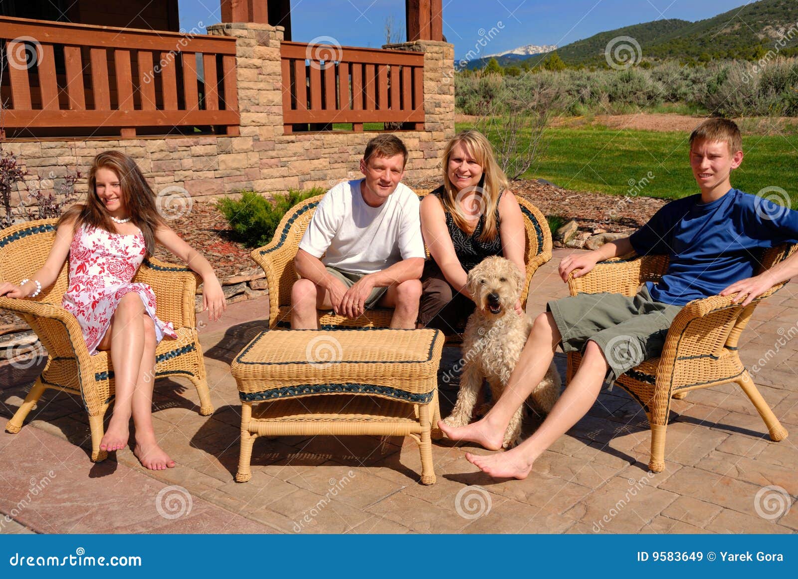 Family by the home stock image. Image of animal, pose - 9583649