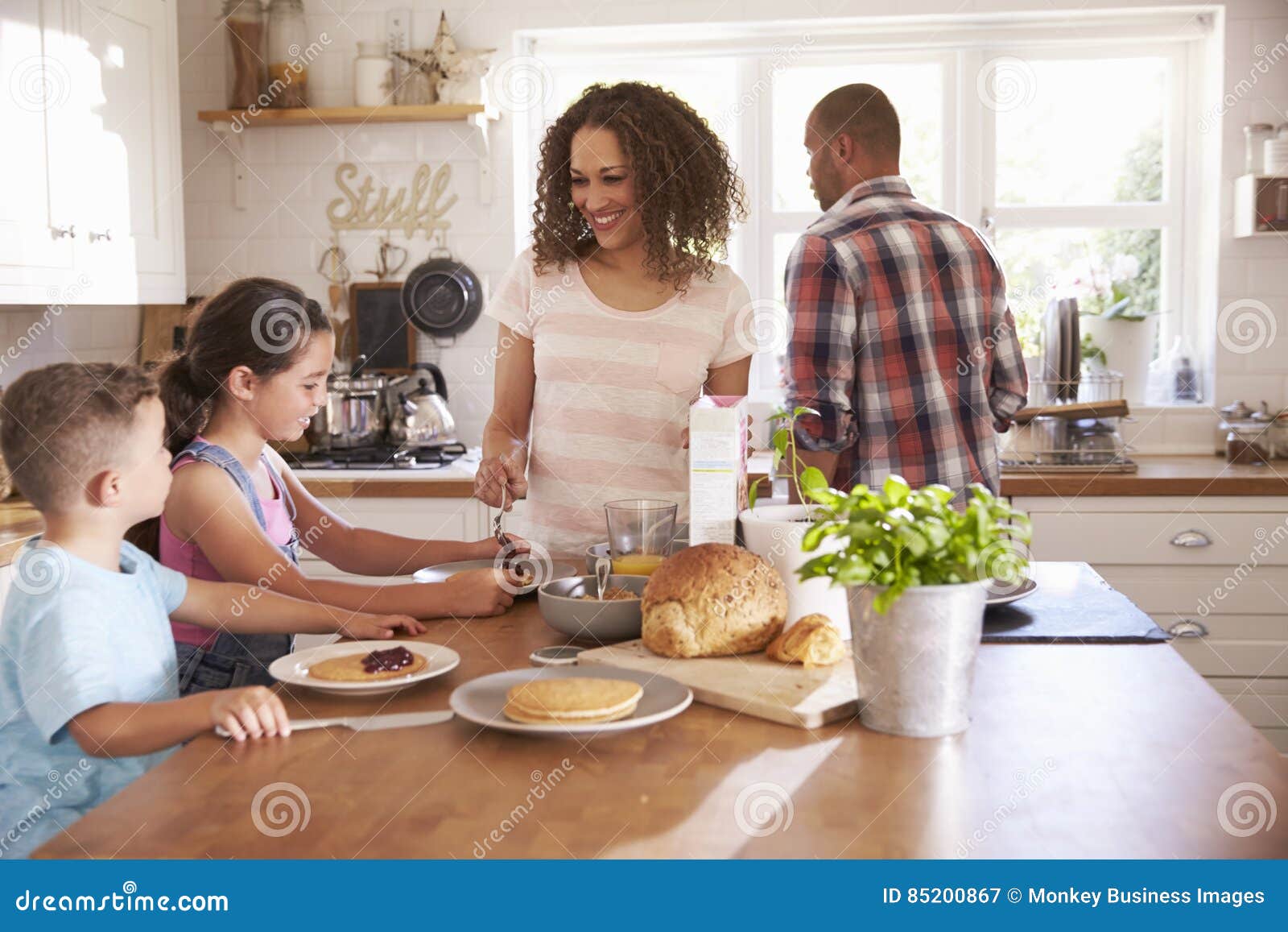 Family at Home Eating Breakfast in Kitchen Together Stock Image - Image ...