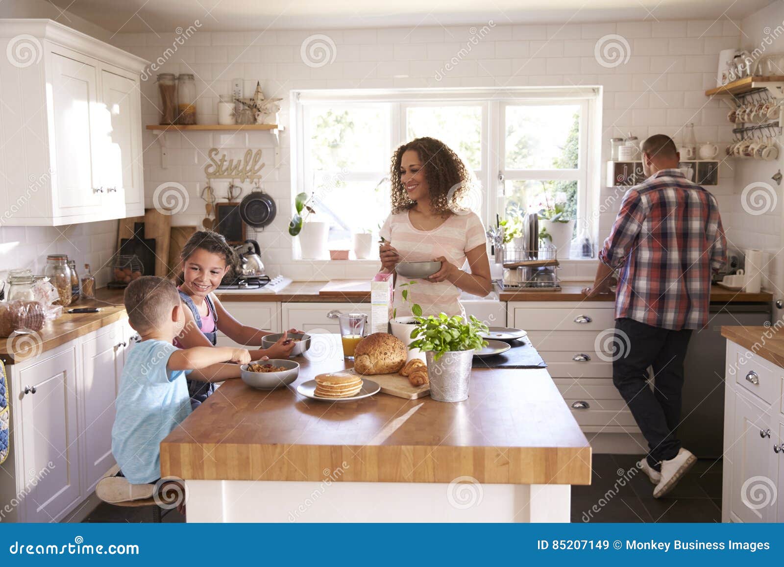 Family at Home Eating Breakfast in Kitchen Together Stock Image - Image ...