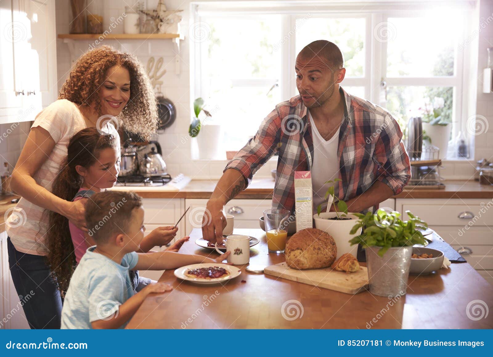 Family at Home Eating Breakfast in Kitchen Together Stock Image - Image ...