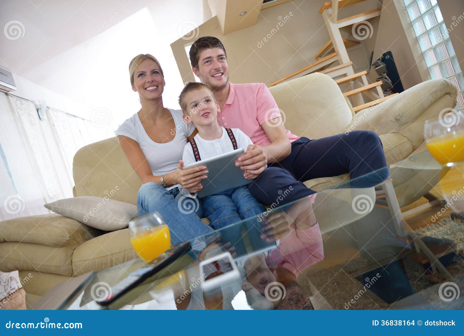 Family at Home Using Tablet Computer Stock Photo - Image of electronic ...