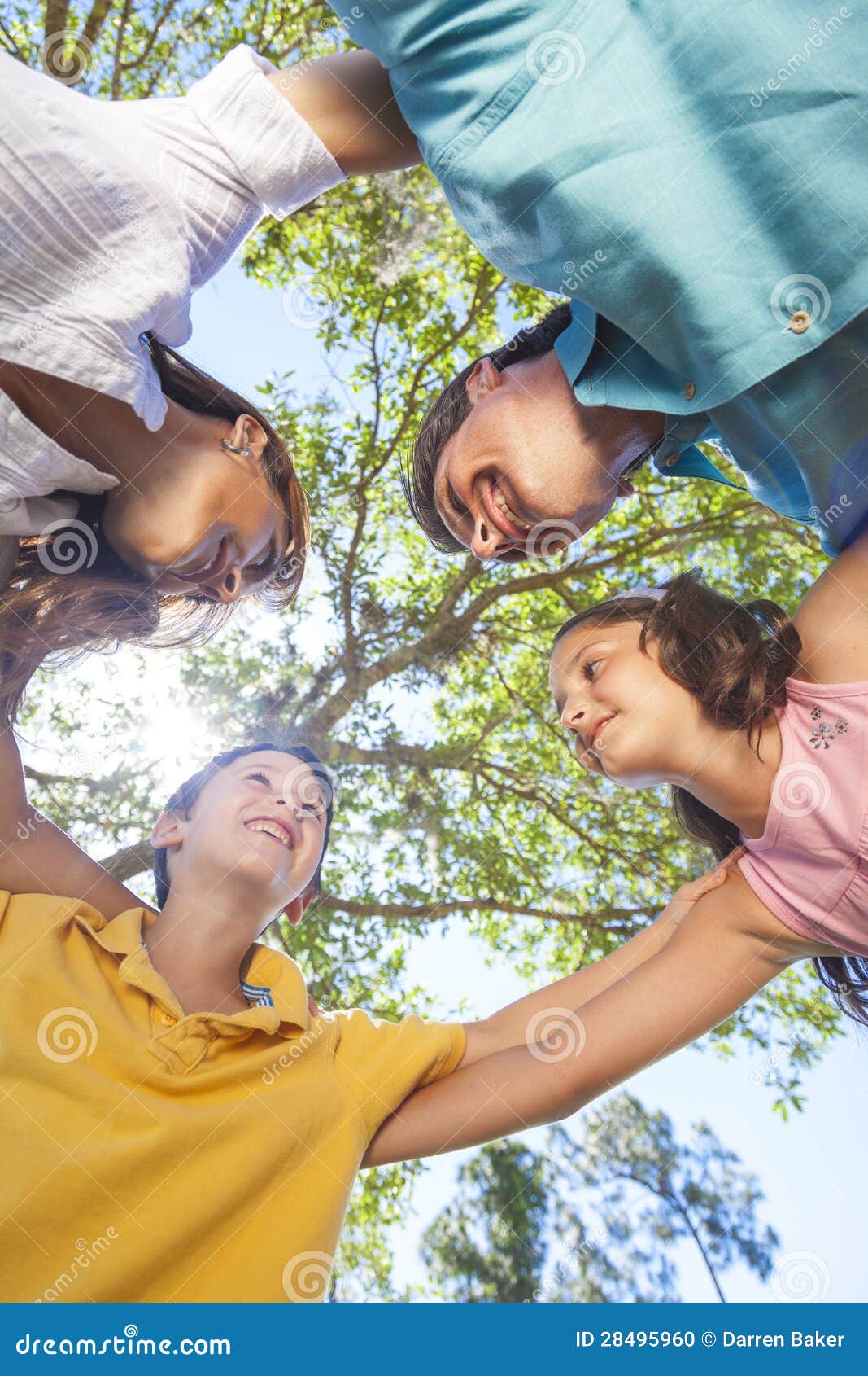 Family Huddle Together Outside in Sunshine Stock Photo - Image of home ...