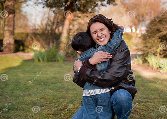 Family Hug stock photo. Image of loving, grass, coat - 16897470
