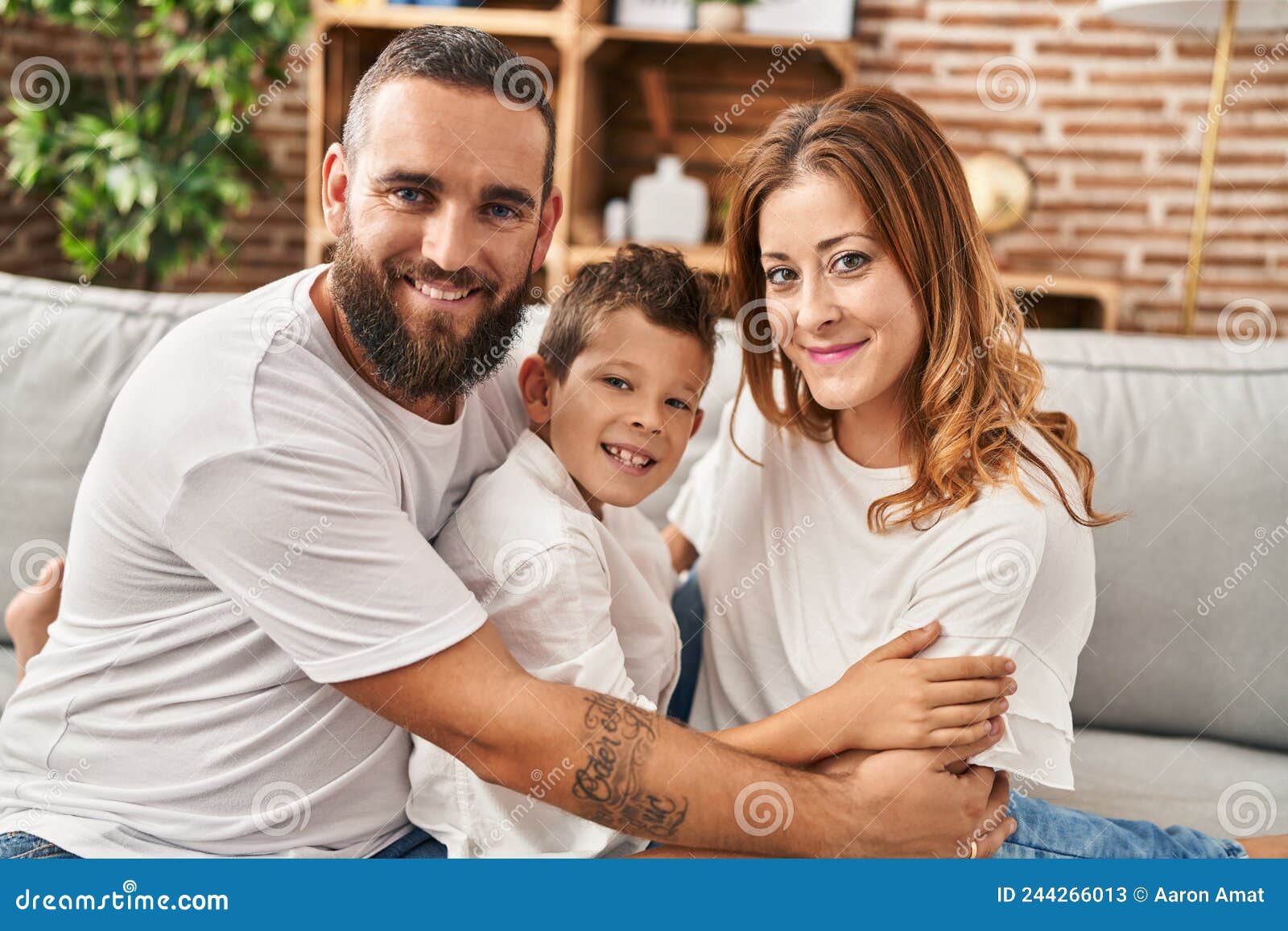 Family Hugging Each Other Sitting on Sofa at Home Stock Image - Image ...