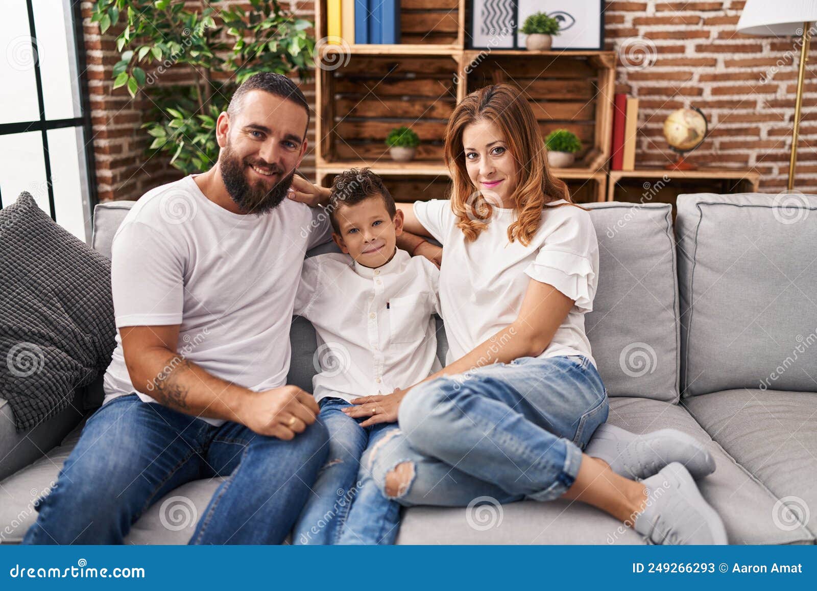 Family Hugging Each Other Sitting on Sofa at Home Stock Image - Image ...