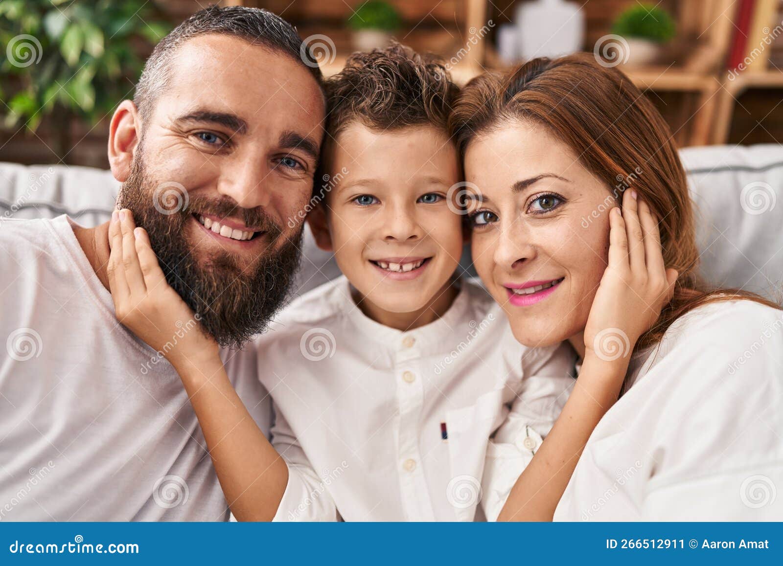 Family Hugging Each Other Sitting on Sofa at Home Stock Image - Image ...