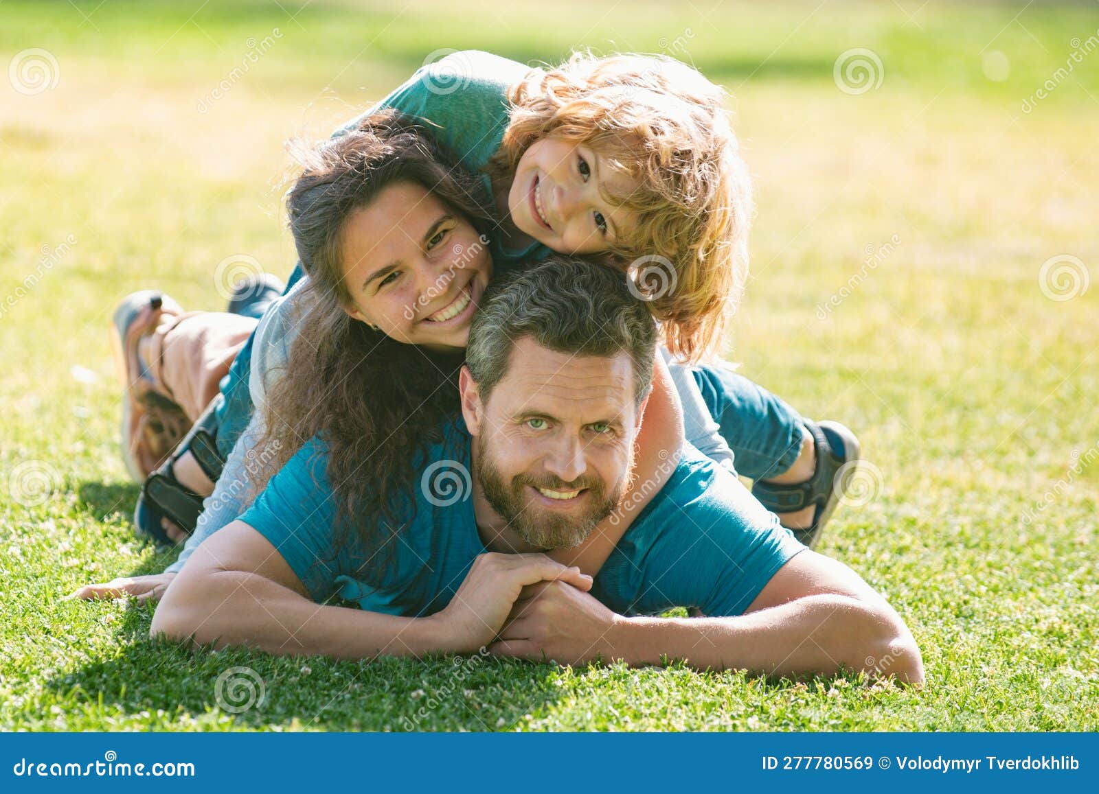 Family Hugging and Embracing on Grass in Park. Stock Image - Image of ...