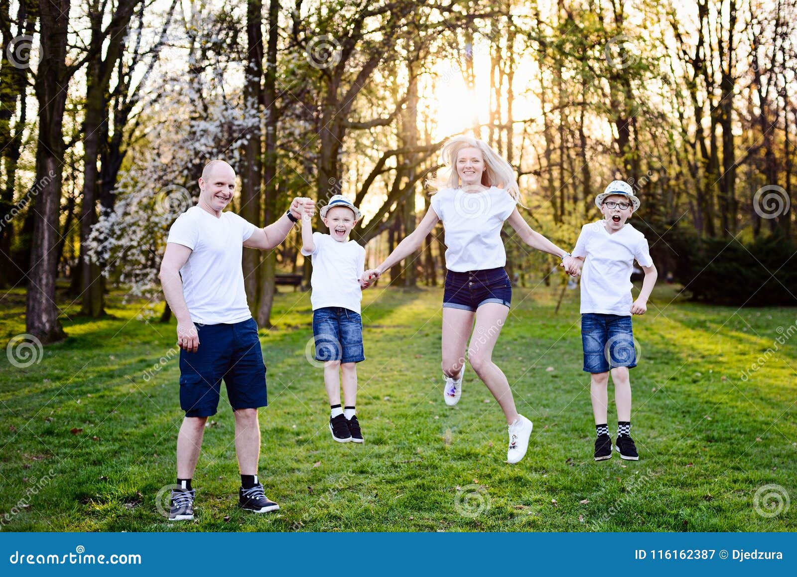 Family jump in park. stock image. Image of leisure, outside - 116162387