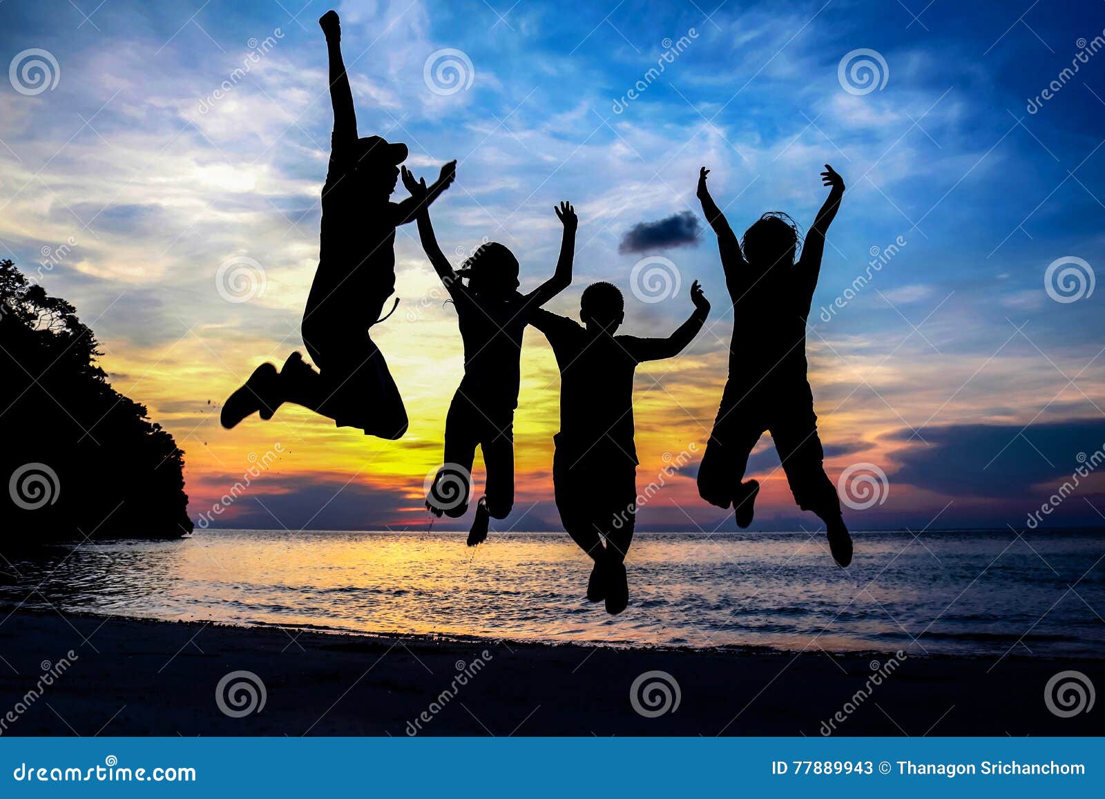Family Jumped on the Beach with Sunset Sky. Stock Image - Image of ...