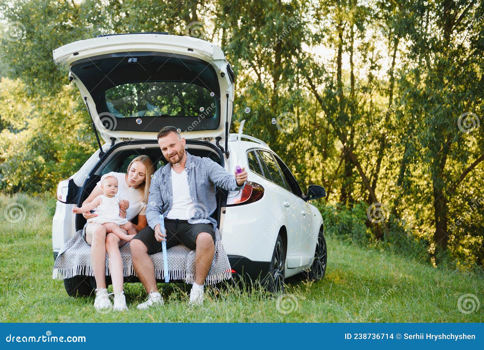 Family with Kid Sitting in Car Trunk Stock Photo - Image of trunk ...