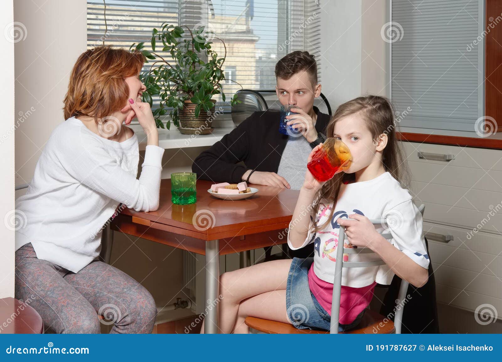 Family on the Kitchen Behind the Table Stock Image - Image of daughter ...