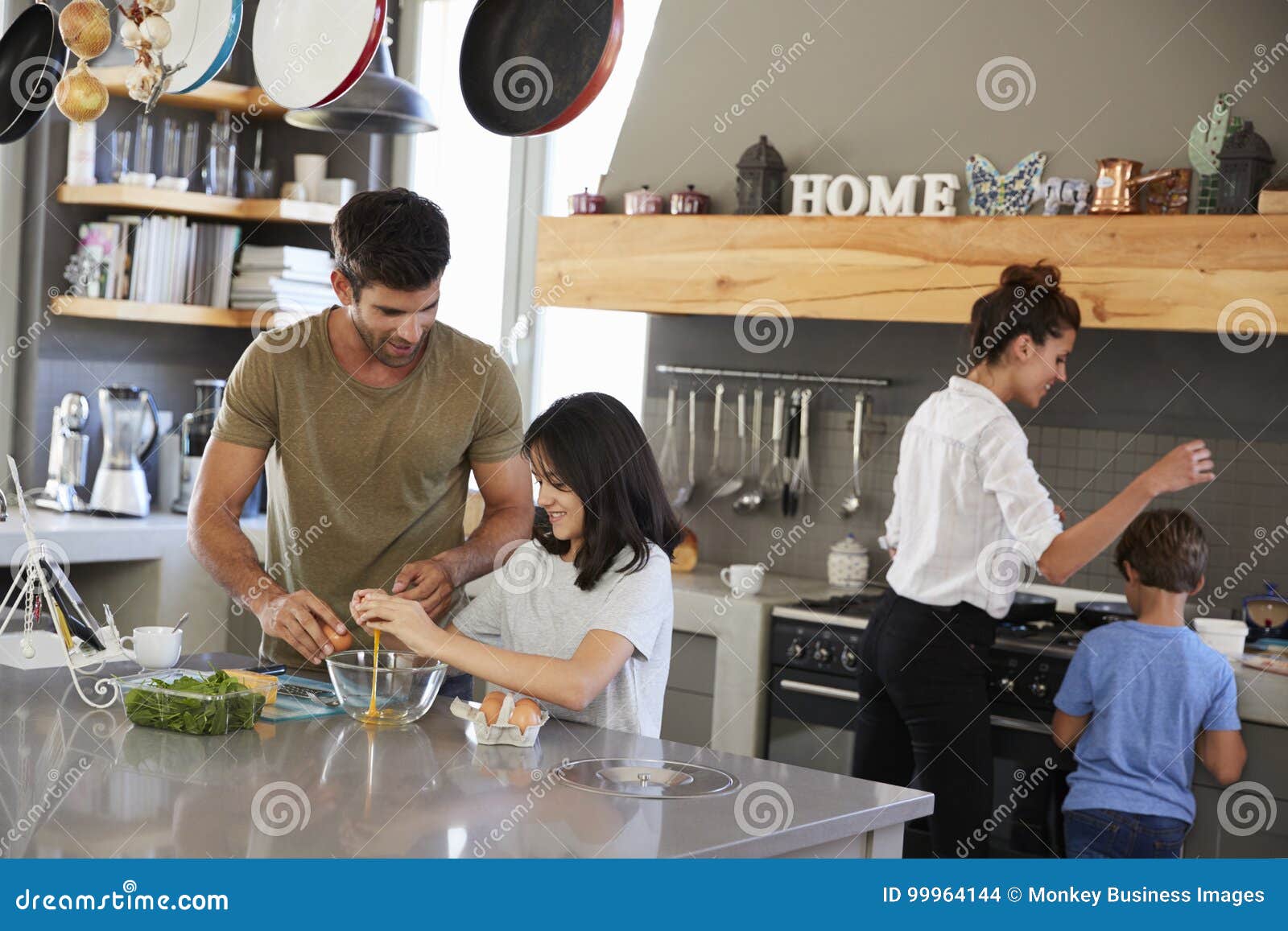 Family in Kitchen Making Morning Breakfast Together Stock Photo - Image ...