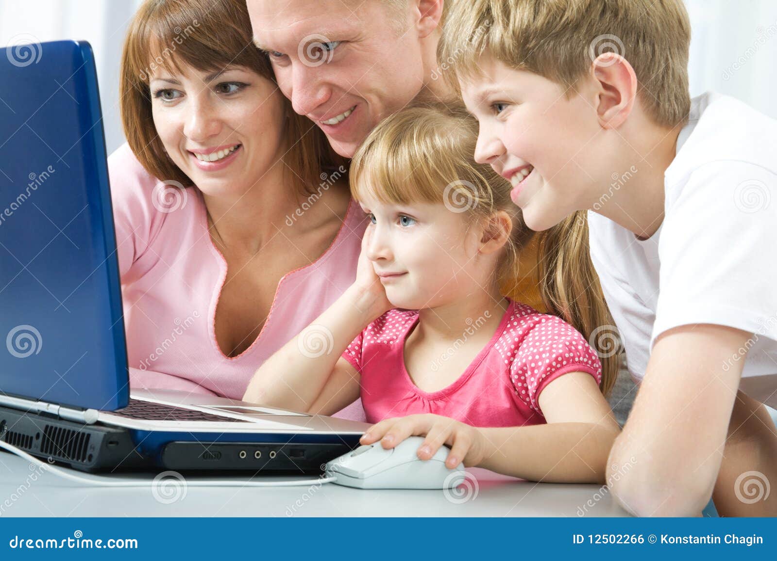 Family with the laptop stock photo. Image of inside, home - 12502266