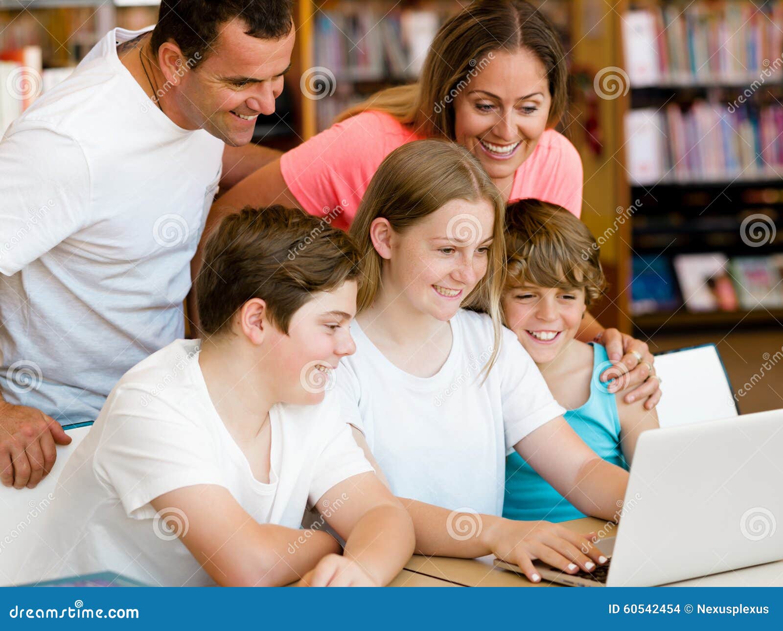 Family in library stock photo. Image of portrait, happy - 60542454