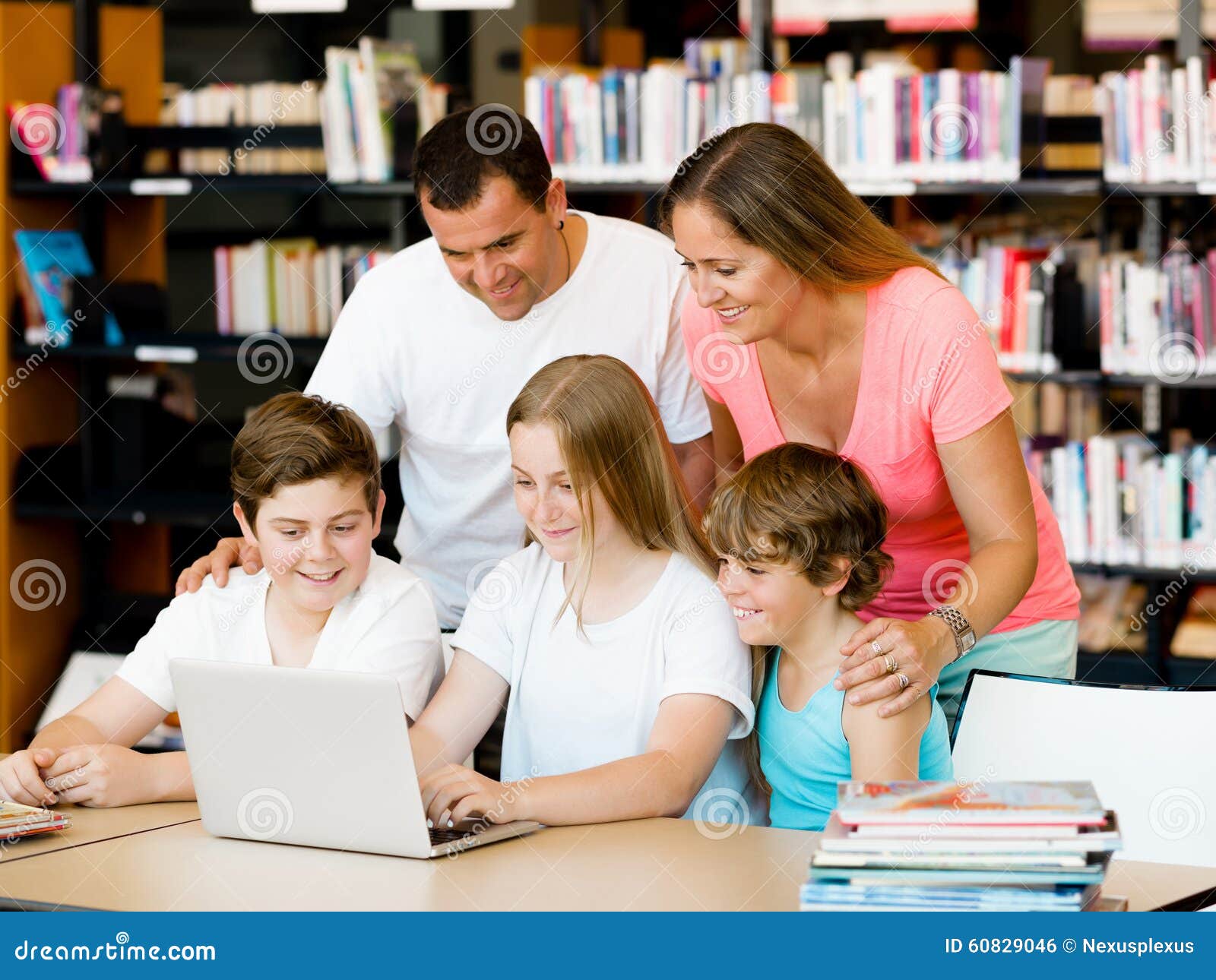 Family in library stock photo. Image of elementary, girl - 60829046