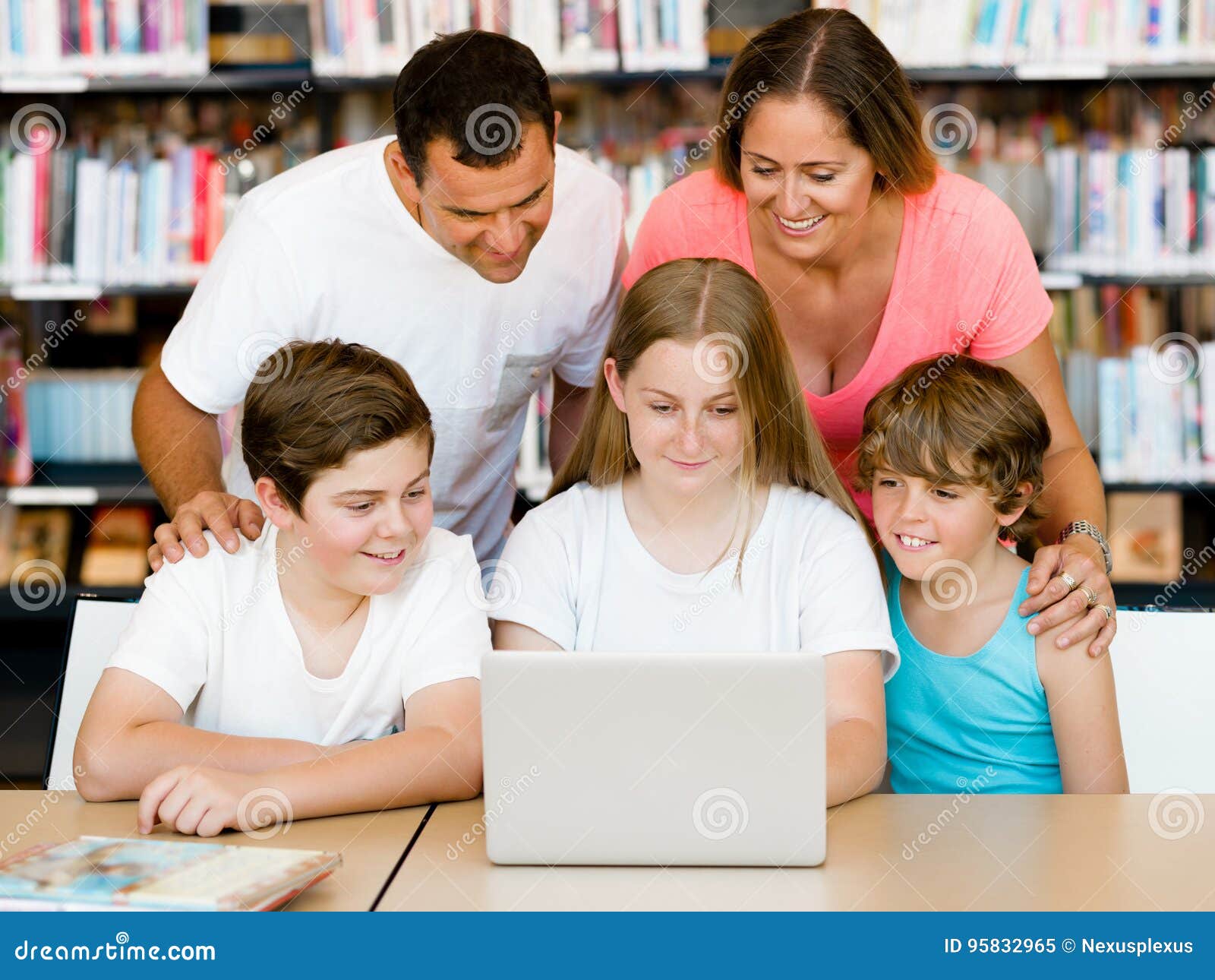 Family in library stock image. Image of book, female - 95832965