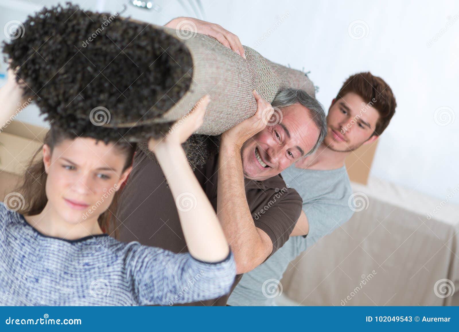 Family Lifting Heavy Carpet Stock Image - Image of daughter, carpet ...