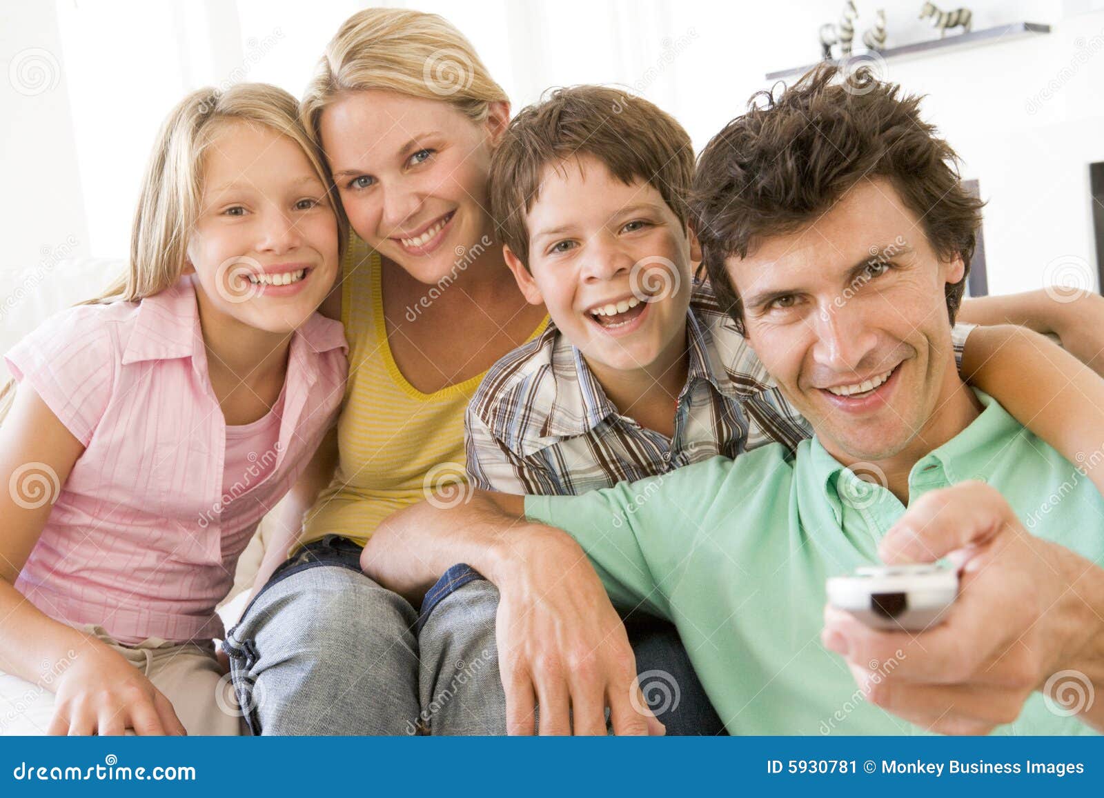 Family in Living Room with Remote Control Stock Image - Image of ...