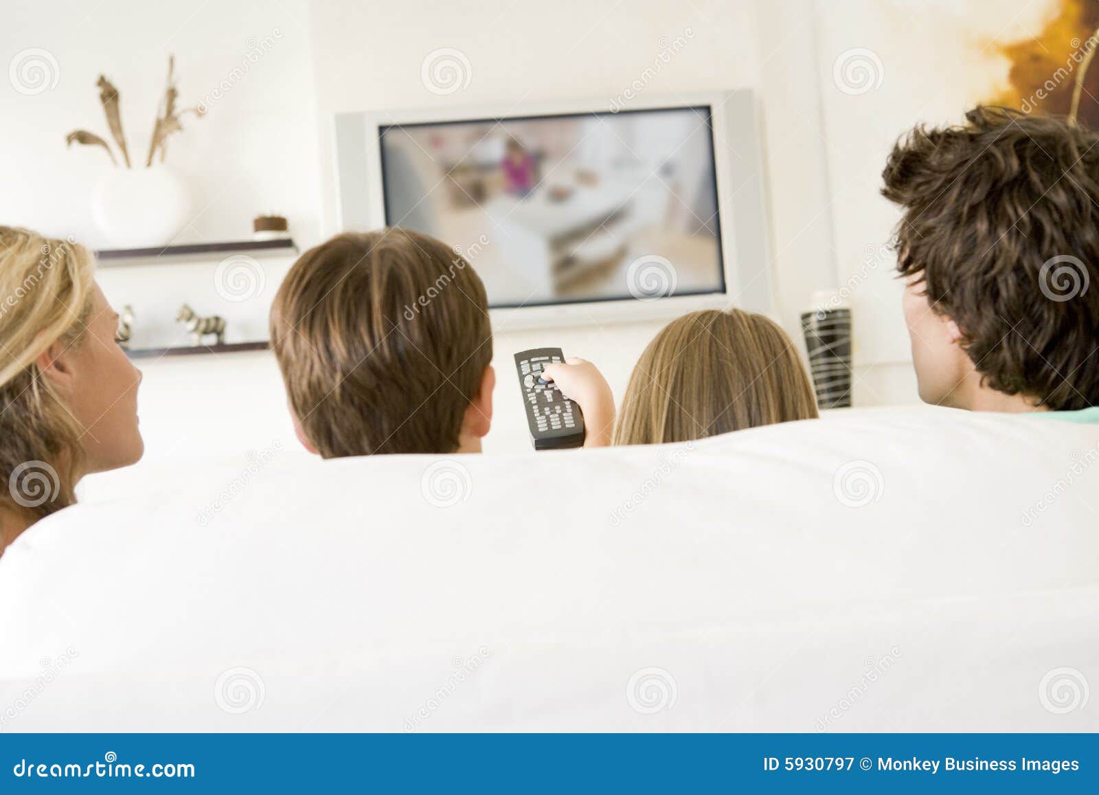 Family in Living Room with Remote Control Stock Image - Image of ...