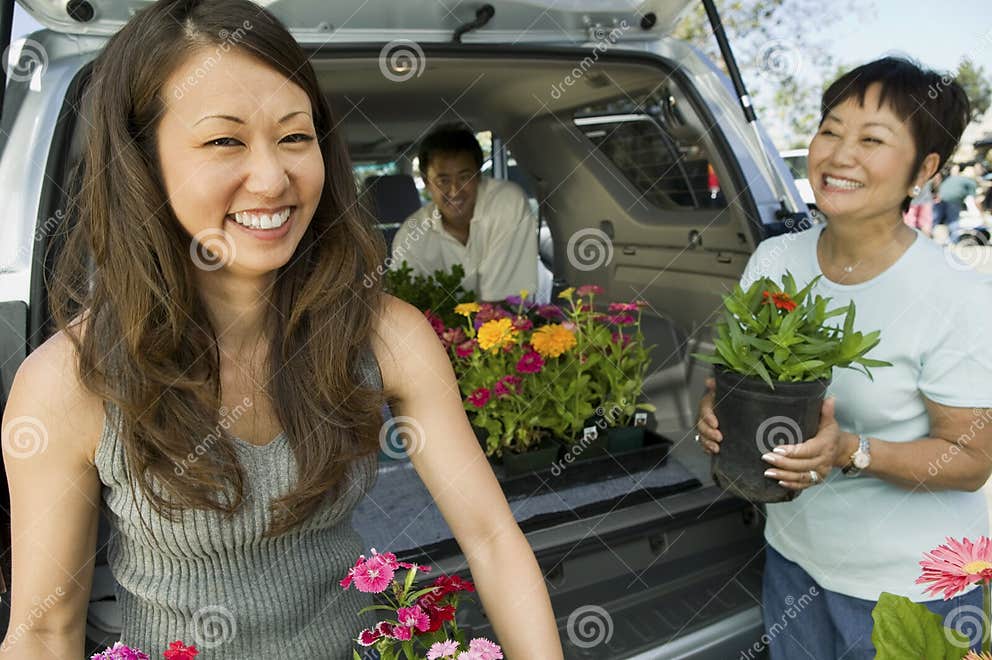 Family Loading Flowers into SUV Stock Photo - Image of motor, outside ...