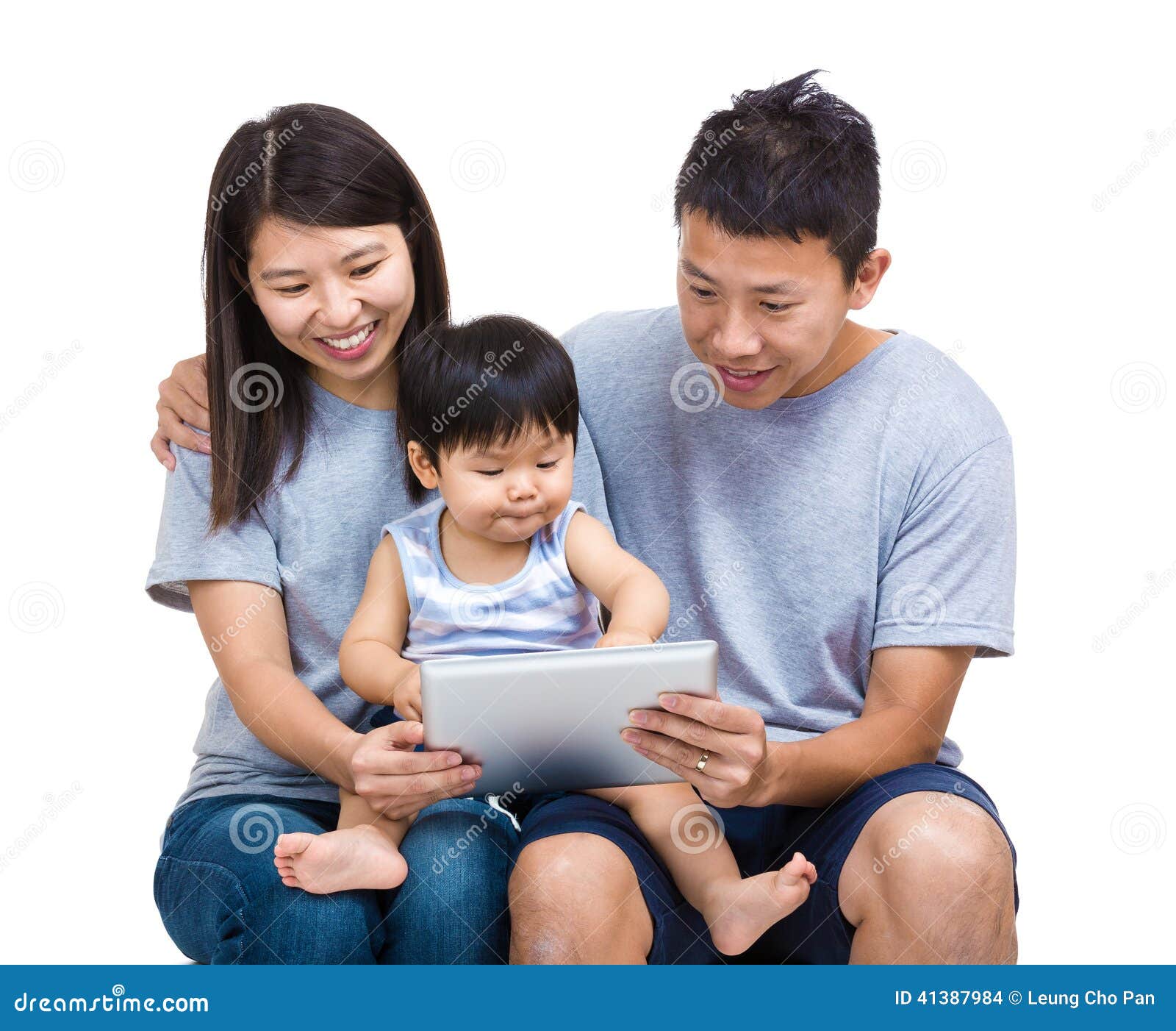 Family Look at Tablet Together Stock Photo - Image of daddy, offspring ...