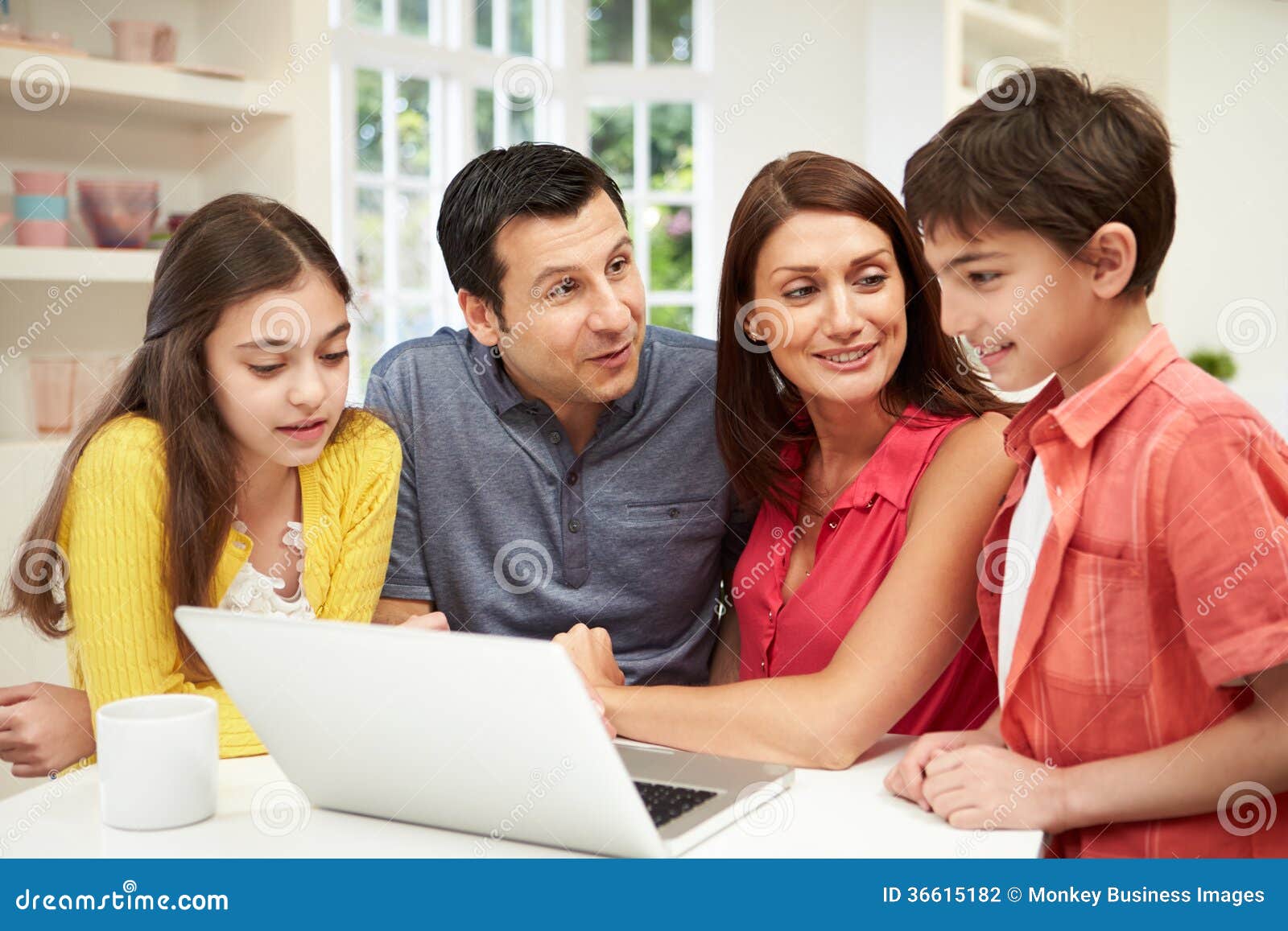 Family Looking at Laptop Over Breakfast Stock Photo - Image of ...