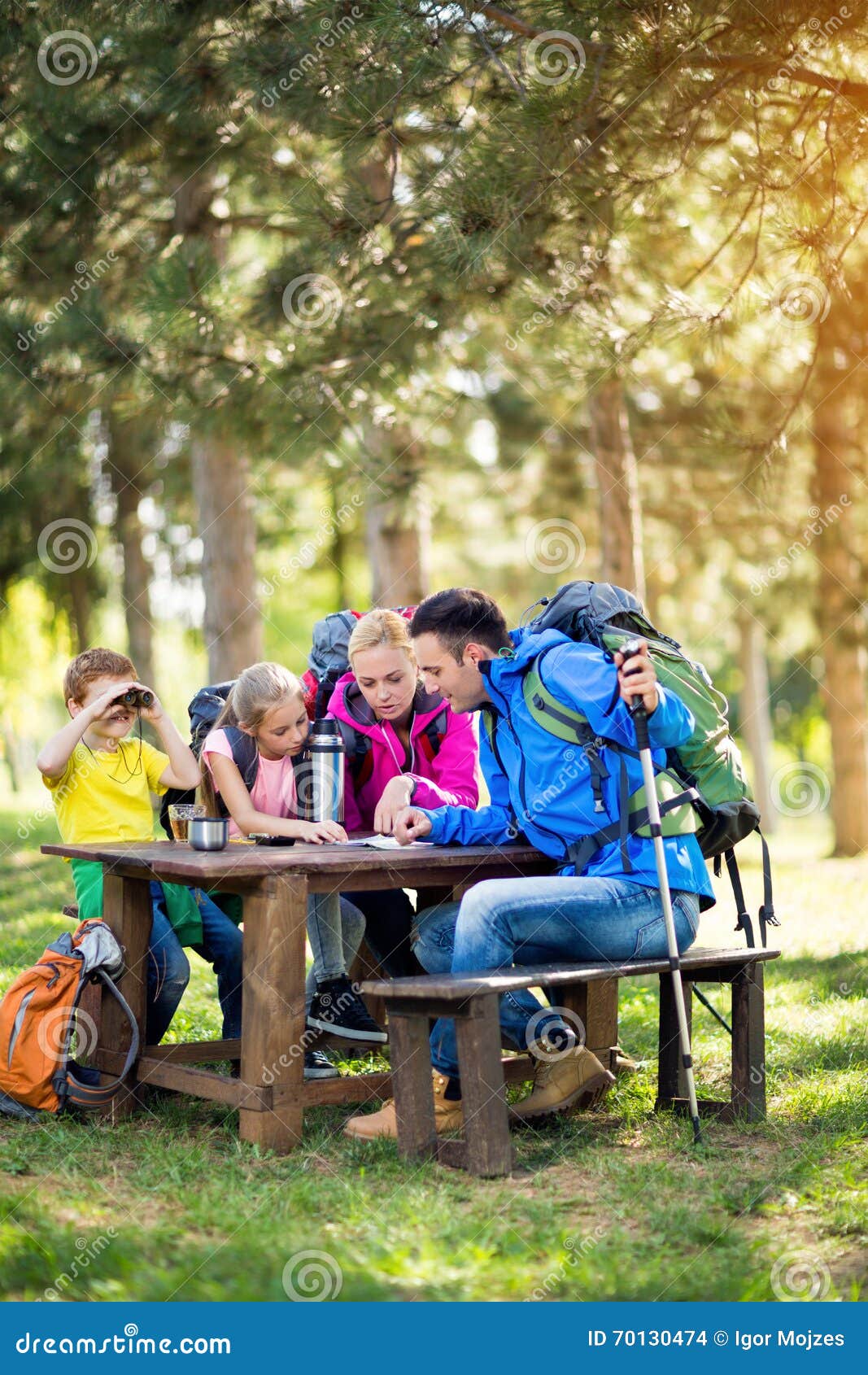Family looking at map stock photo. Image of hiker, smile - 70130474
