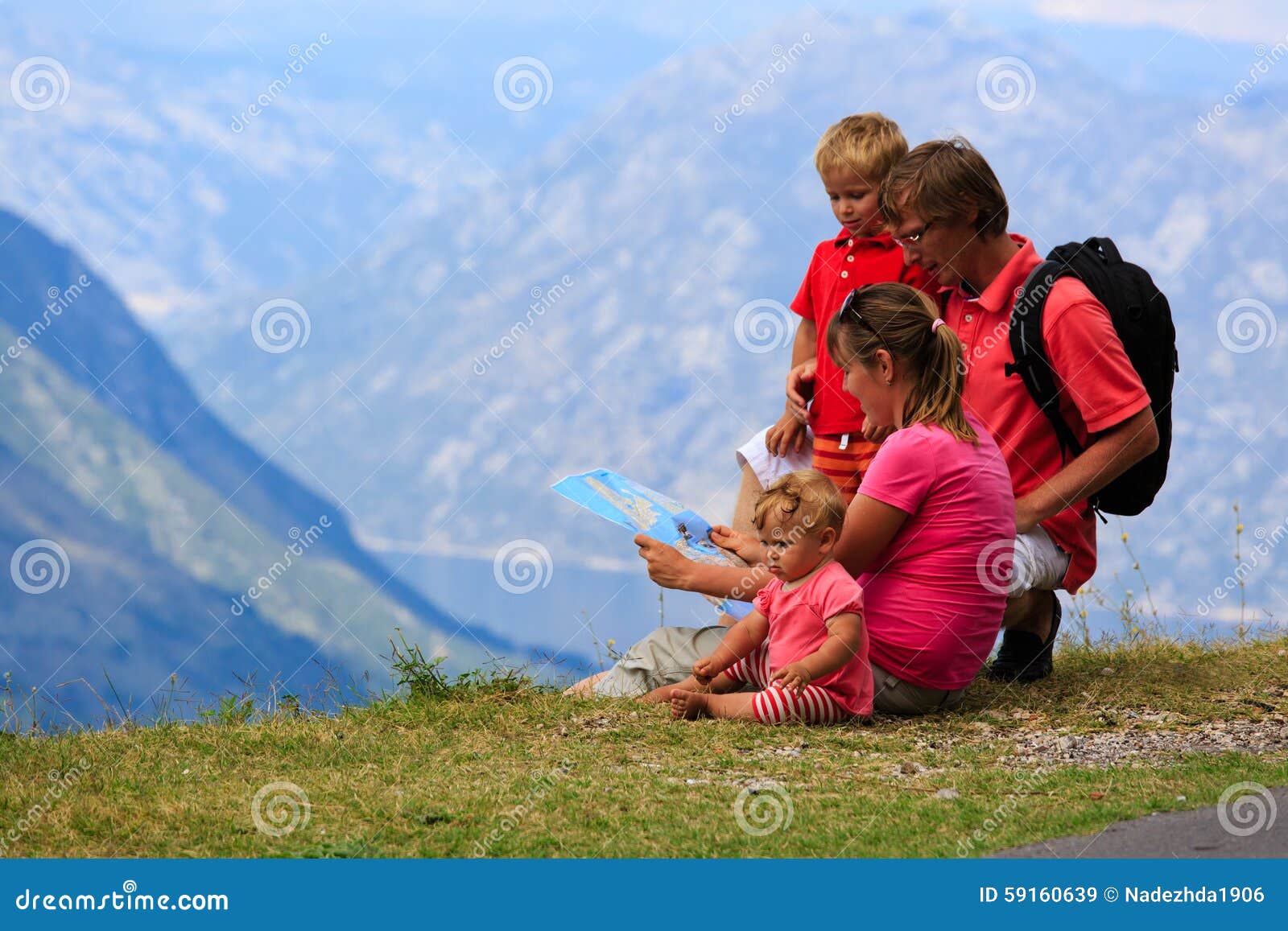 Family Looking at Map in Mountains Stock Image - Image of father ...