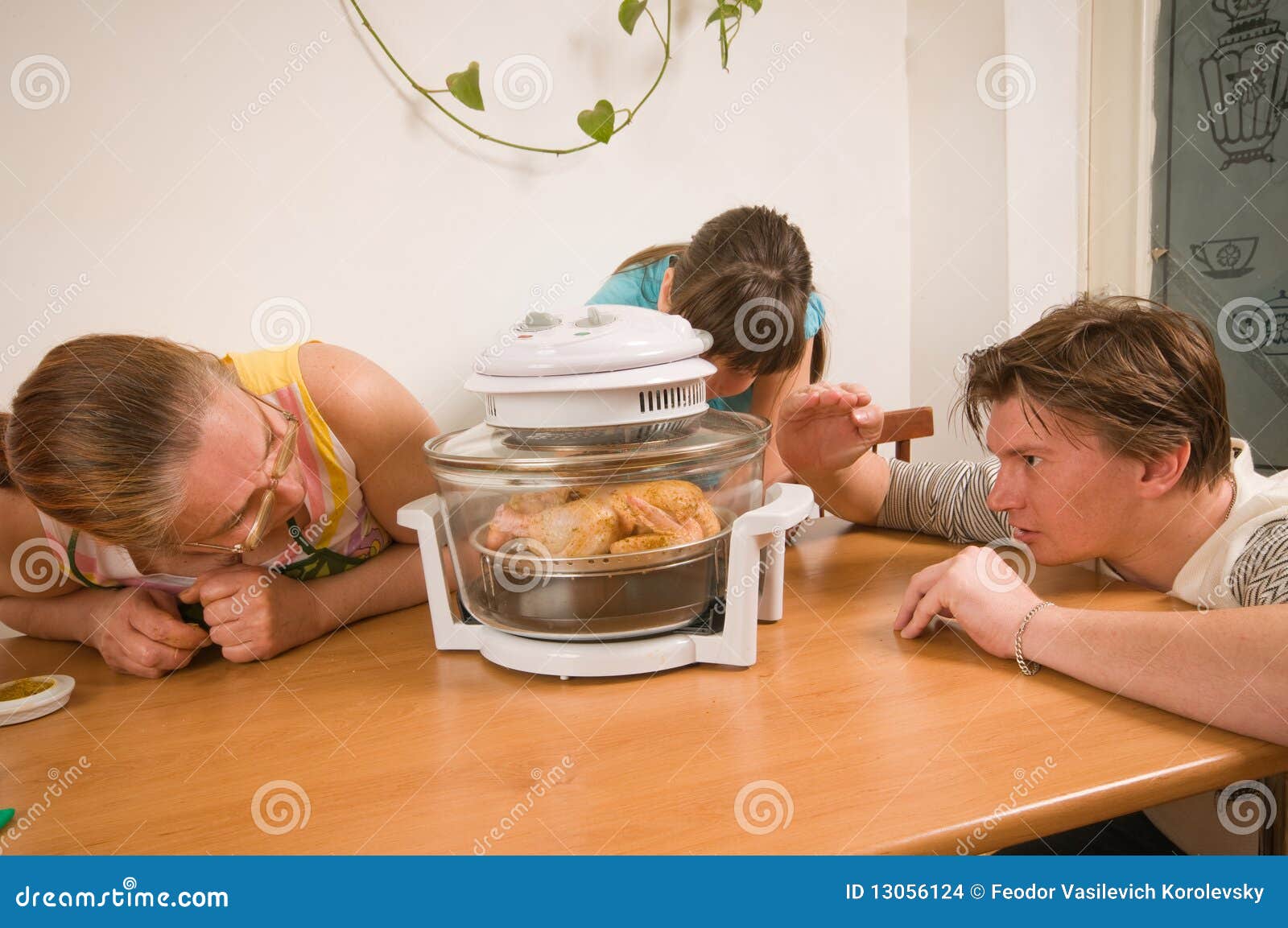 The family makes a supper. stock photo. Image of assistant - 13056124