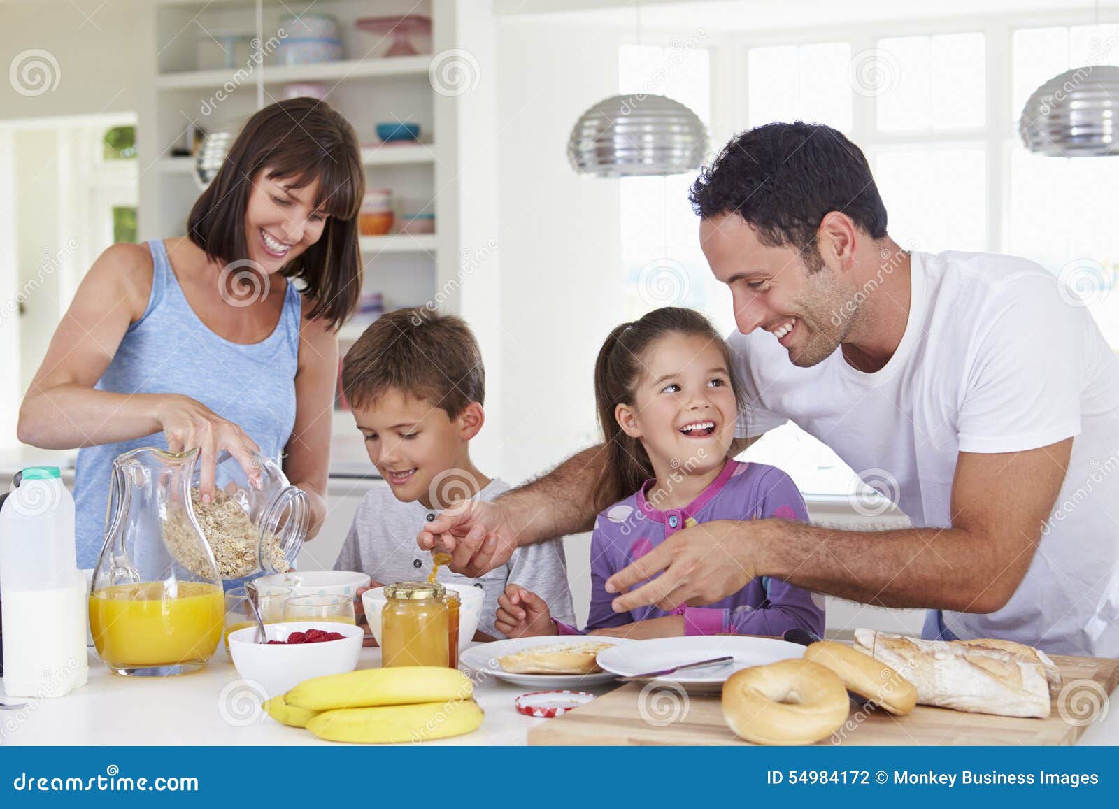 Family Making Breakfast in Kitchen Together Stock Photo - Image of ...