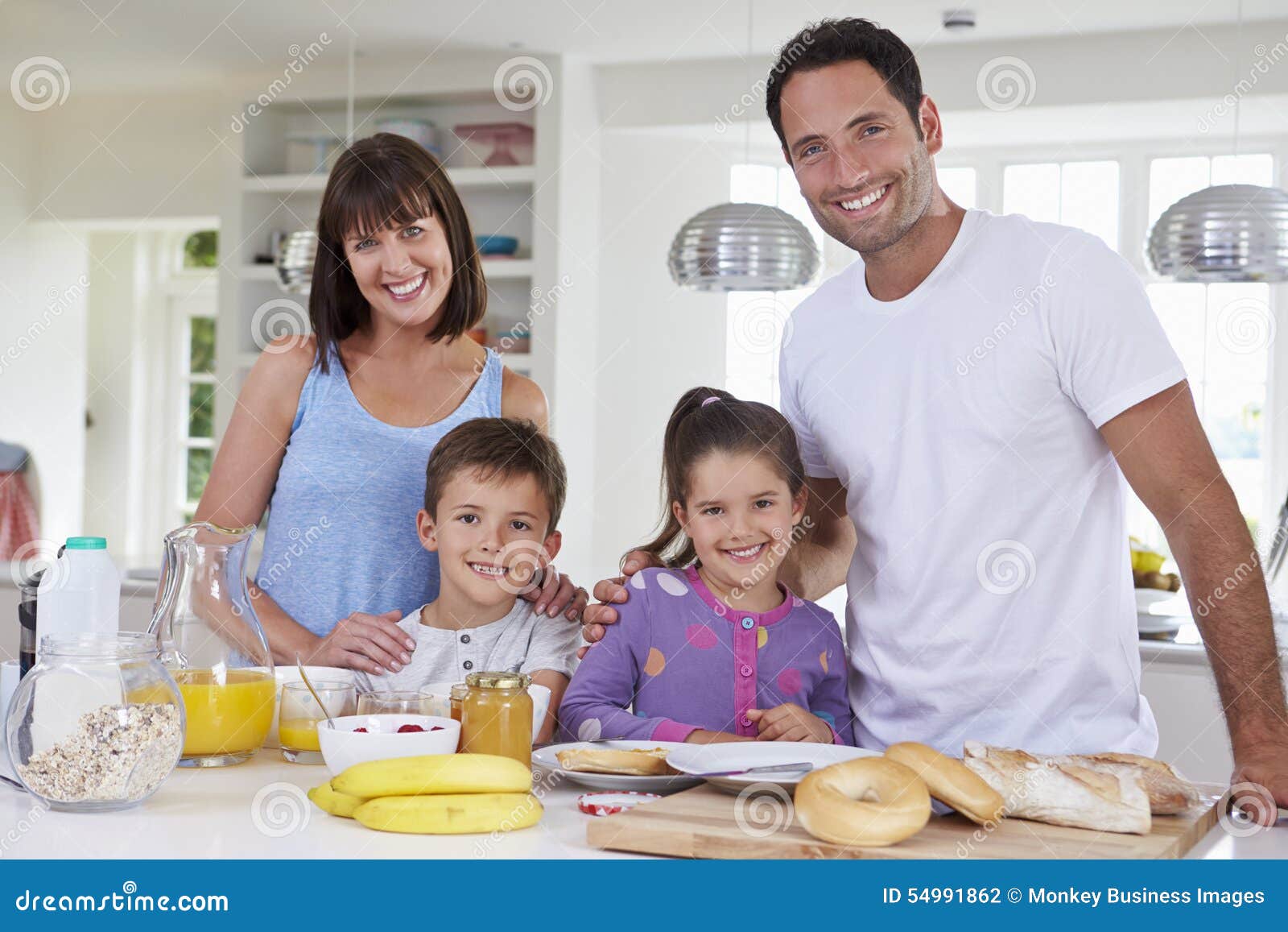 Family Making Breakfast in Kitchen Together Stock Photo - Image of ...