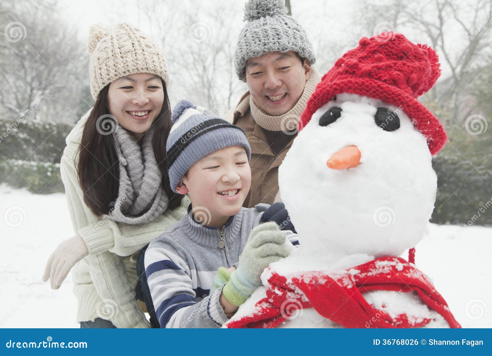 Boy Making Snowman Royalty-Free Stock Image | CartoonDealer.com #10592260
