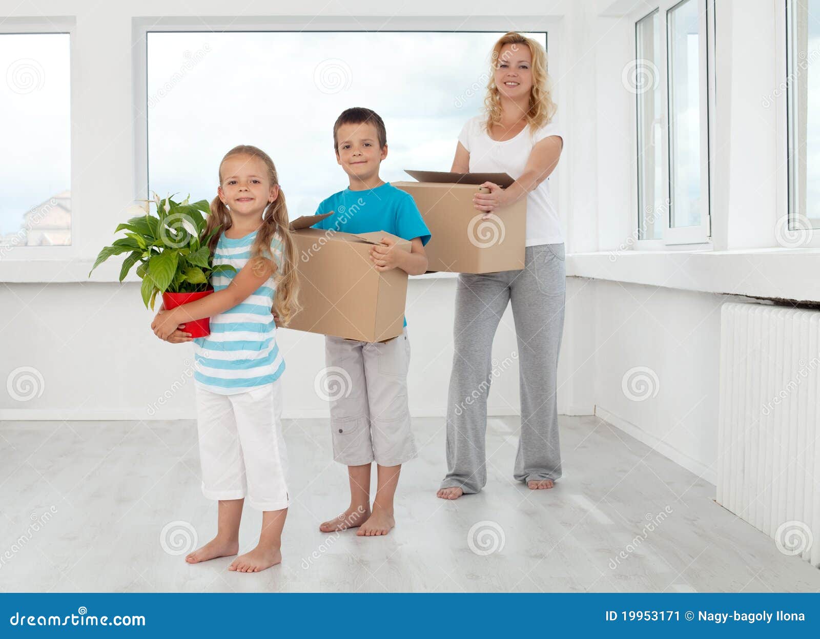 Family Moving in a New Home Stock Image - Image of cheerful, moving ...