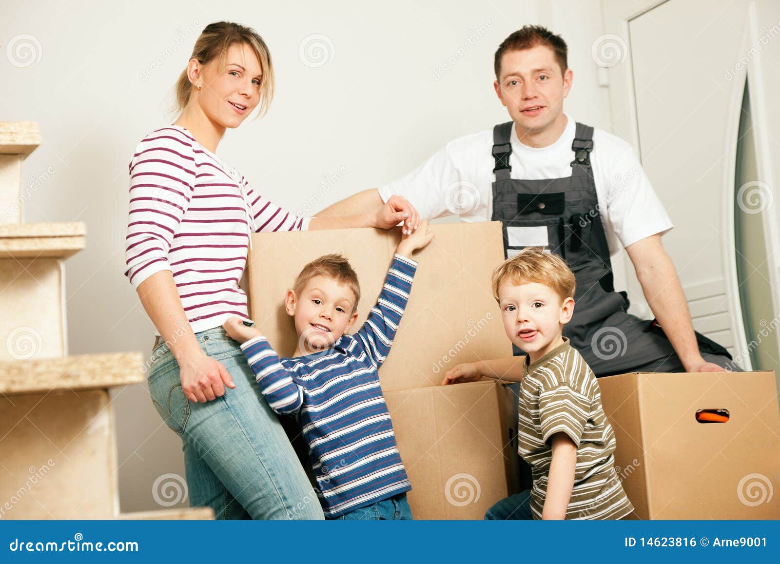 Family Moving in Their New House Stock Photo - Image of cardboard ...