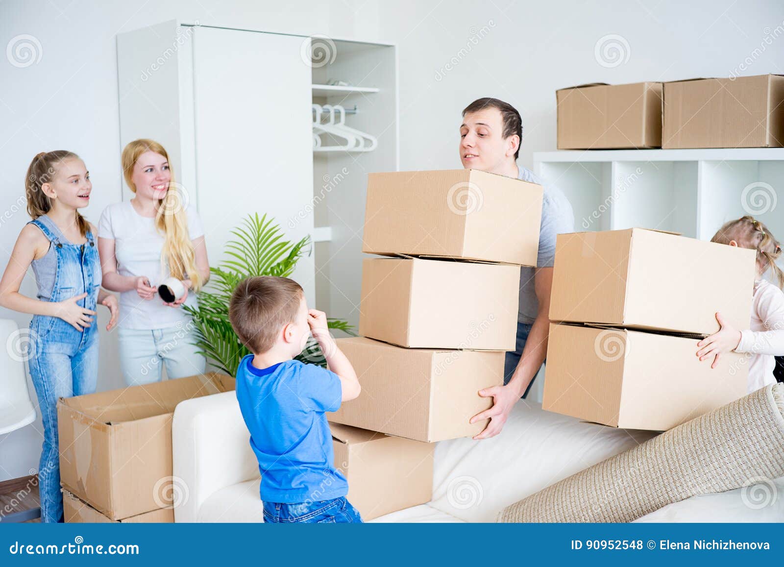 Family Packing Cardboard Boxes Stock Photo - Image of indoors ...