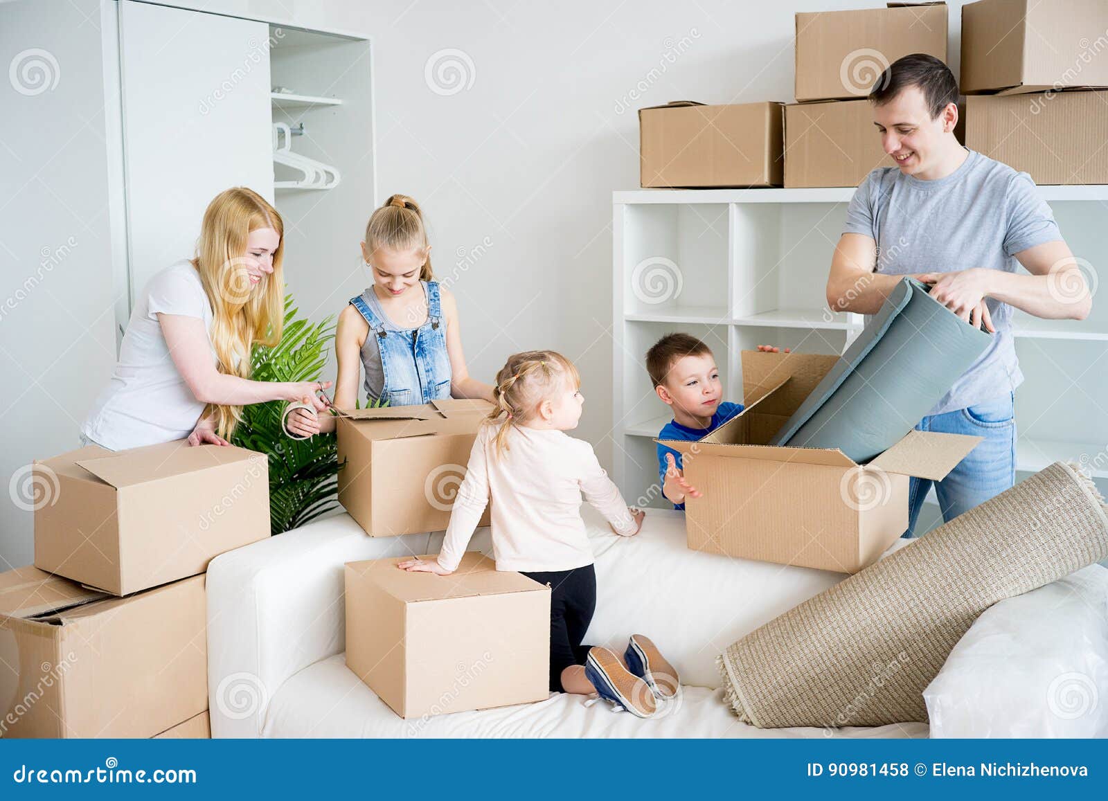 Family Packing Cardboard Boxes Stock Photo - Image of mother, childhood ...