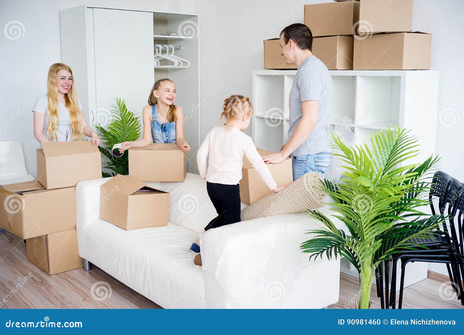 Family Packing Cardboard Boxes Stock Photo - Image of casual, cute ...