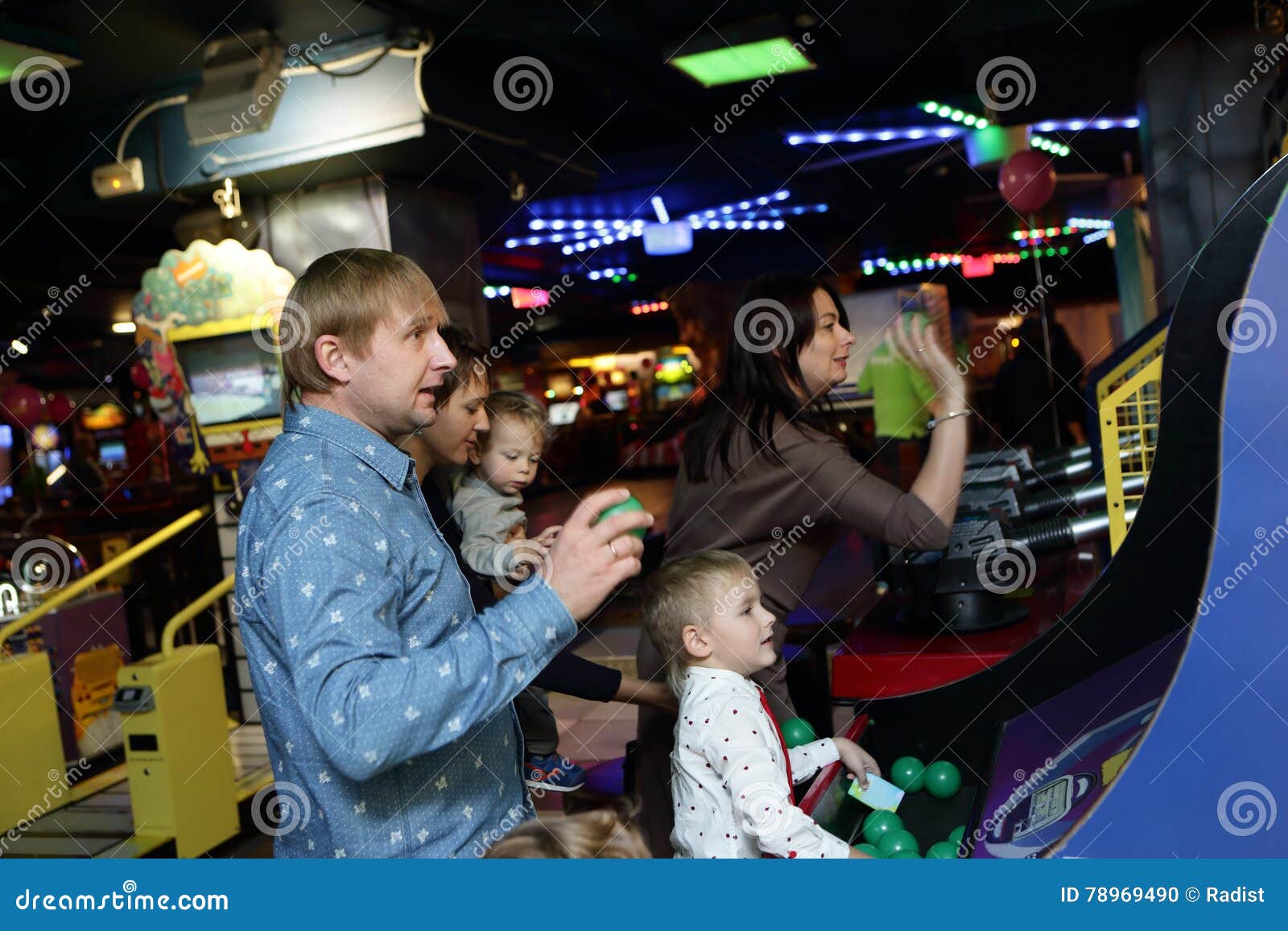 Family Playing at an Amusement Park Stock Photo - Image of chance ...