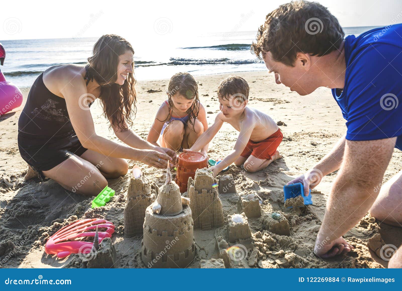 Family Playing on the Beach Stock Photo - Image of holiday ...