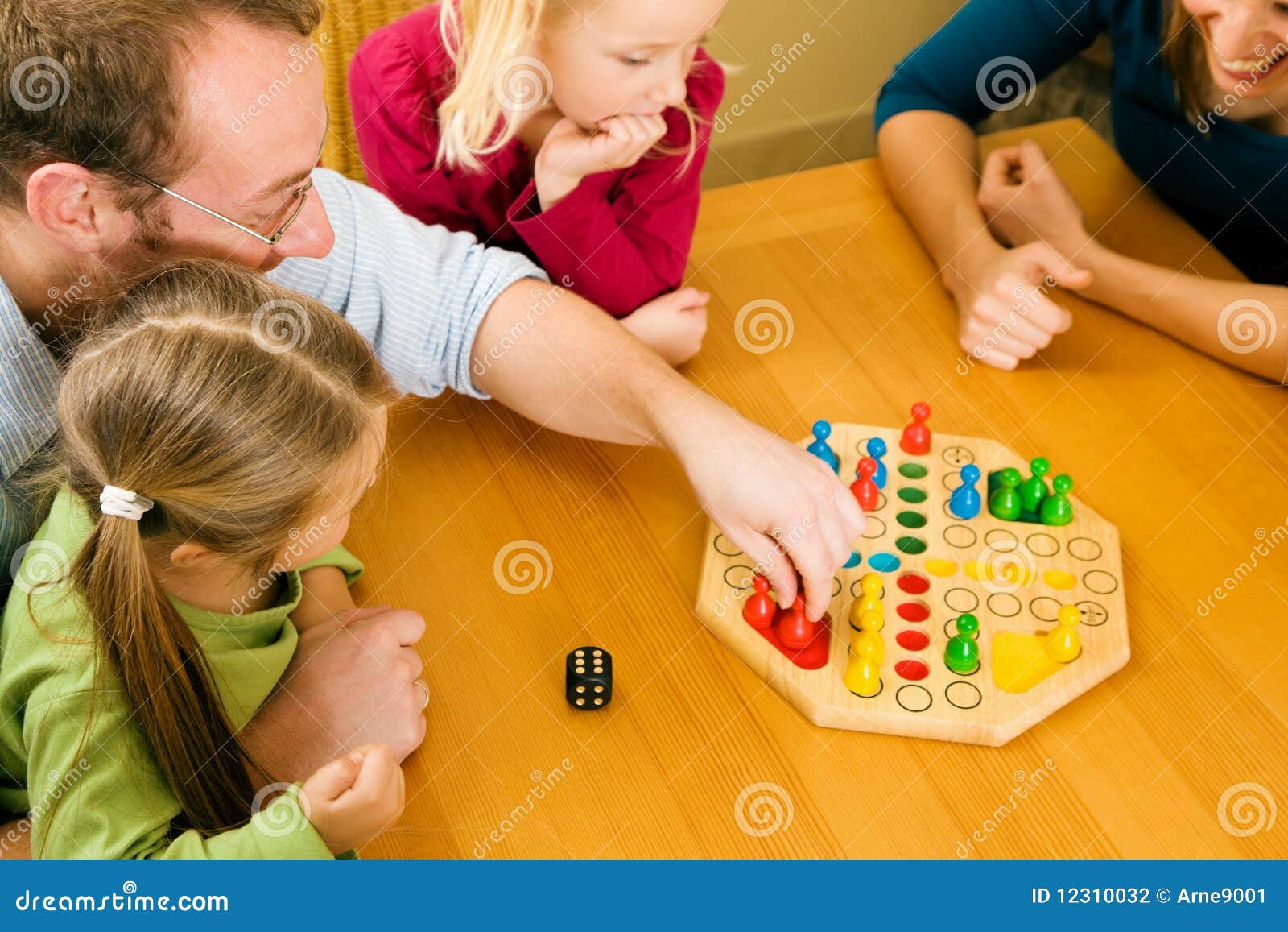 Family Playing a Board Game Stock Photo - Image of parents, leisure ...