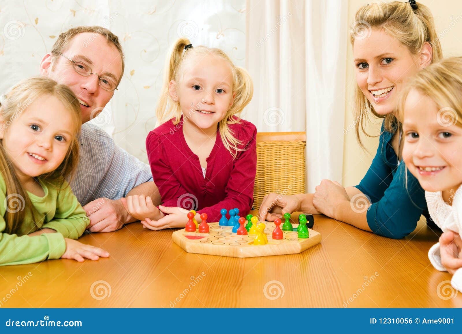 Family Playing a Board Game Stock Photo - Image of daughters, mother ...