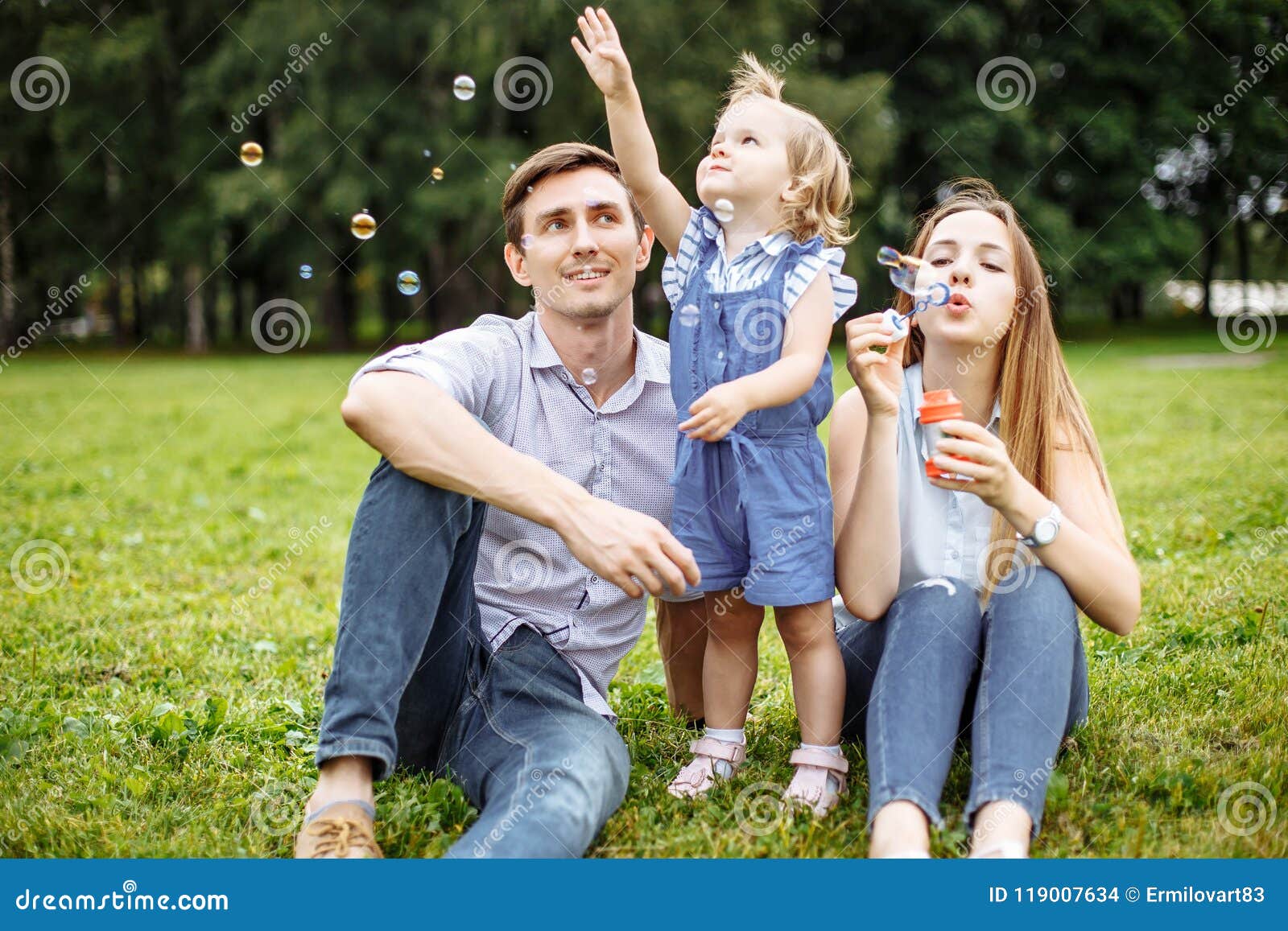 Family Playing with Bubbles Outdoors Stock Photo - Image of outdoors ...