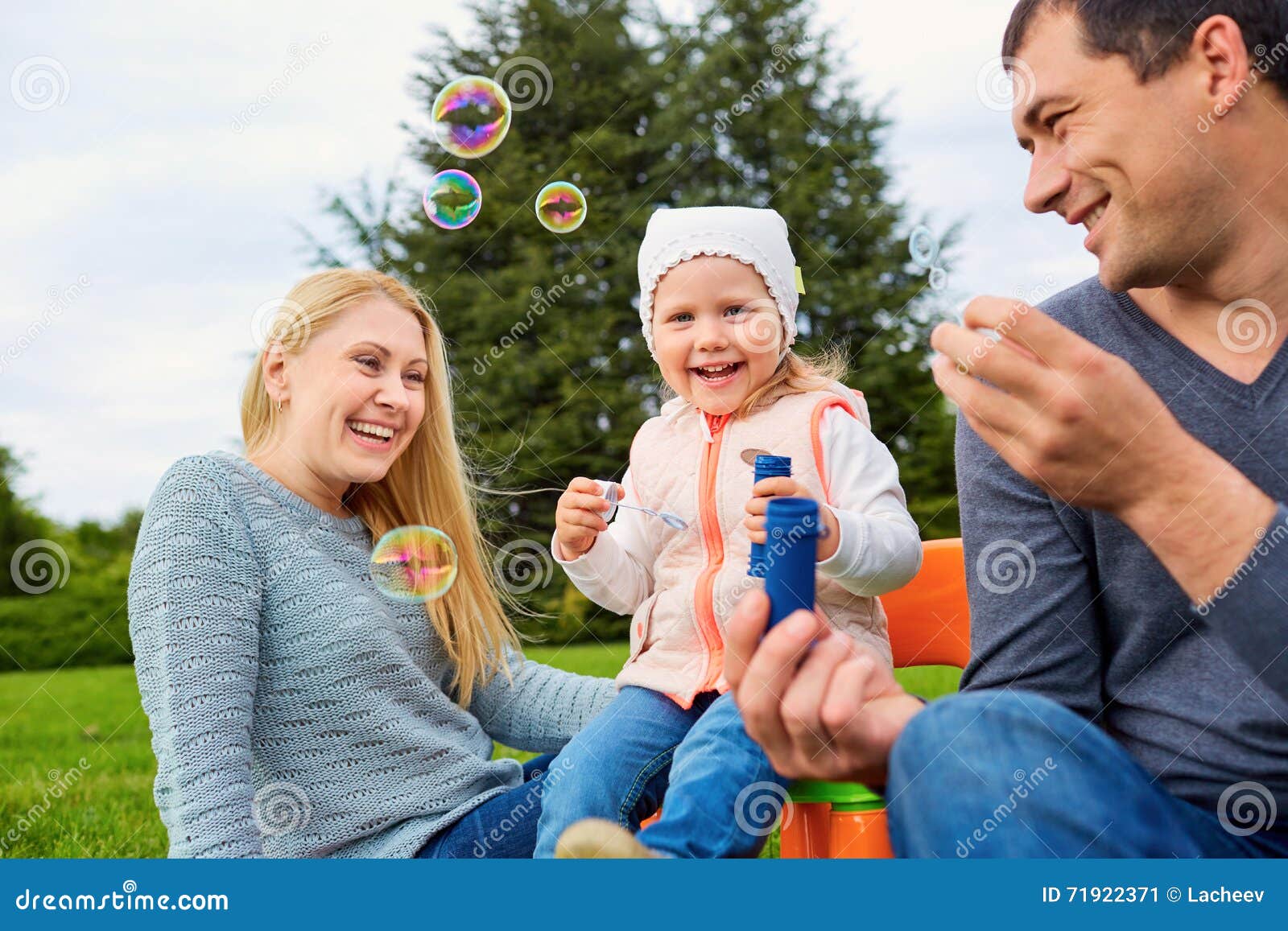 Family Playing with Bubbles Outdoors. Stock Image - Image of child ...
