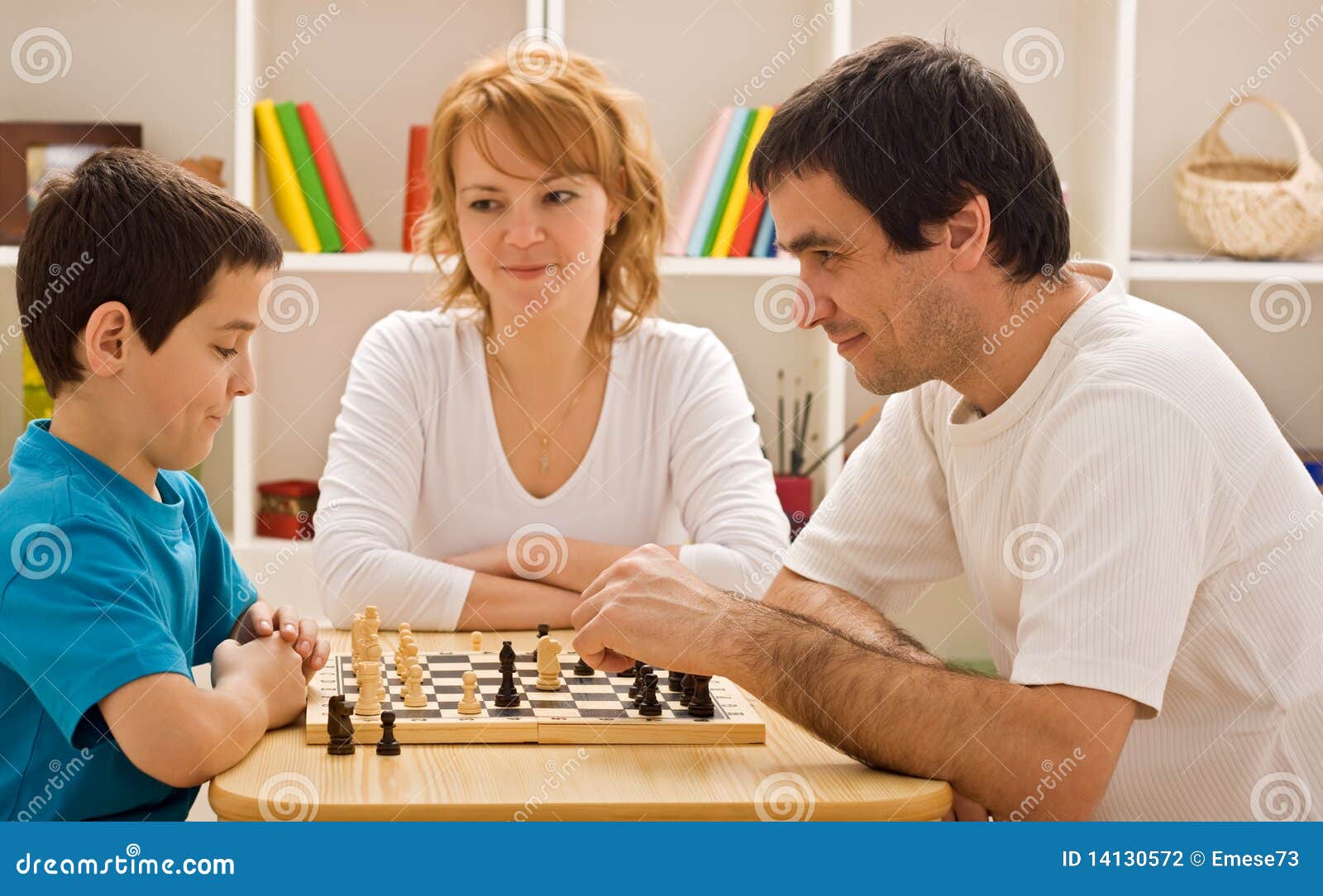 Family playing chess stock photo. Image of male, face - 14130572