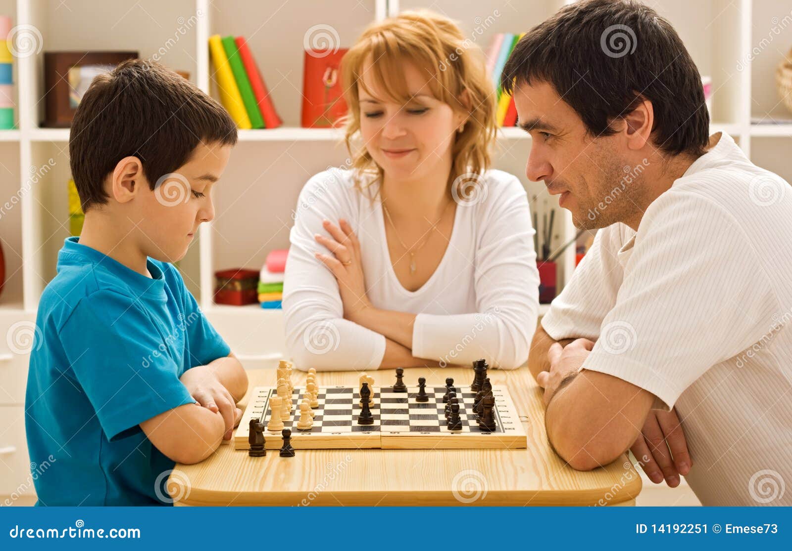 Family playing chess stock image. Image of casual, board - 14192251