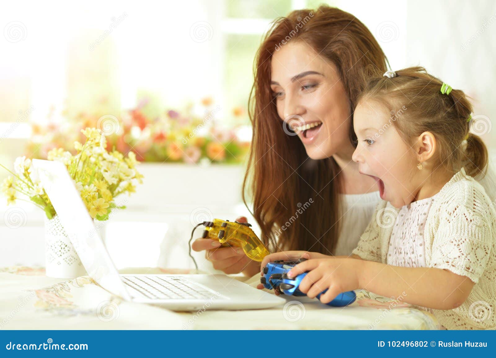Family Playing Computer Game Stock Photo - Image of women, laptop ...
