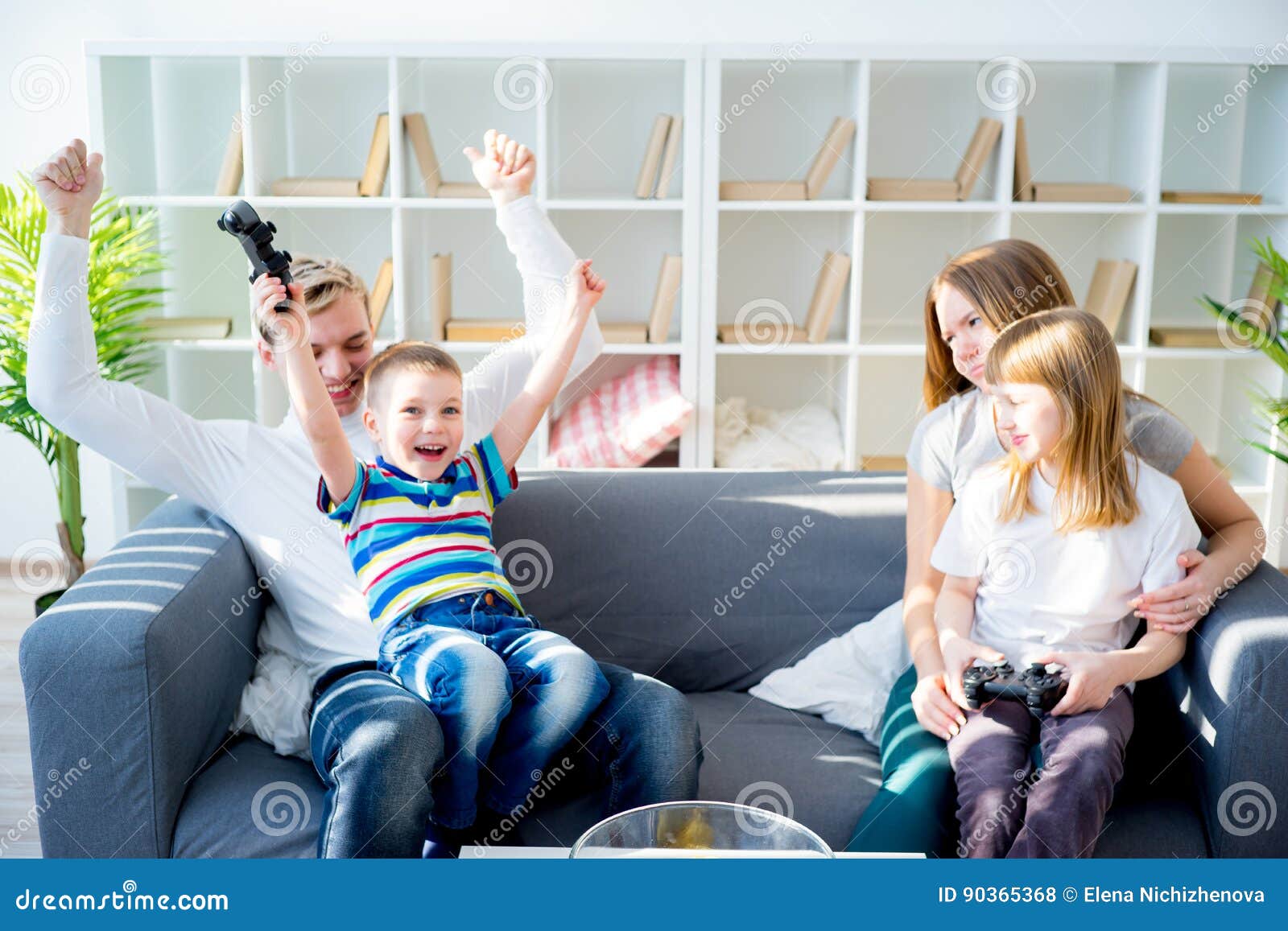 Family playing console stock photo. Image of house, hobby - 90365368