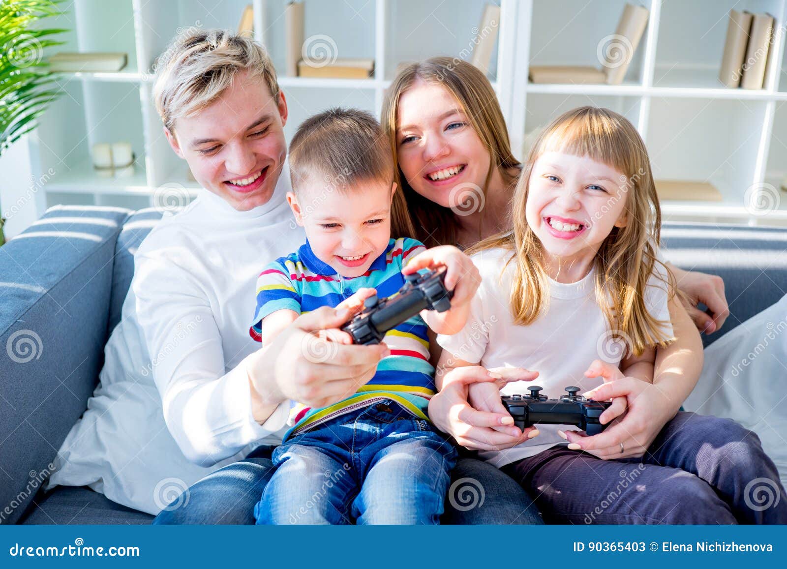 Family playing console stock image. Image of hobby, nintendo - 90365403