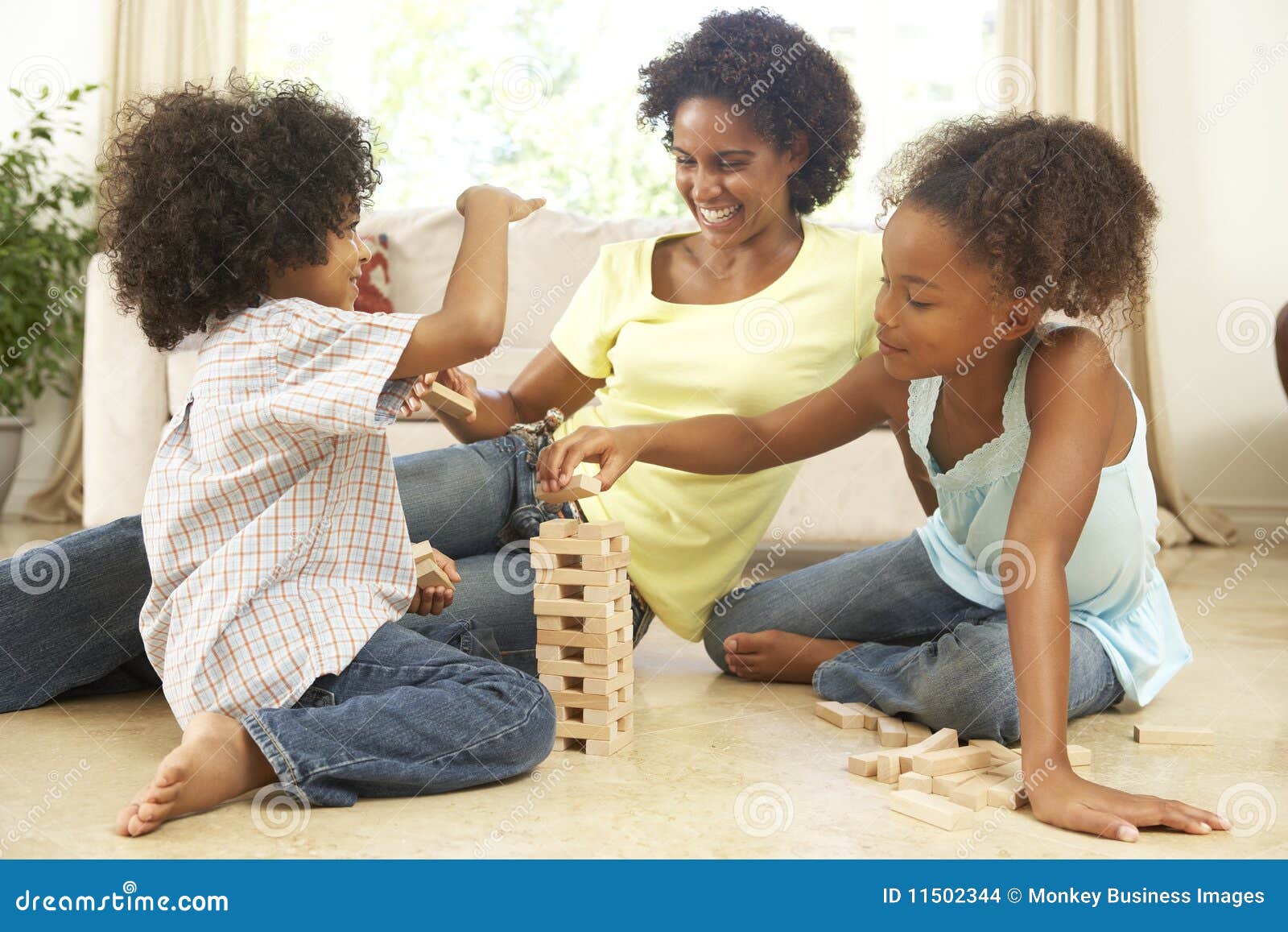 Family Playing Game at Home Stock Photo - Image of girl, brother: 11502344