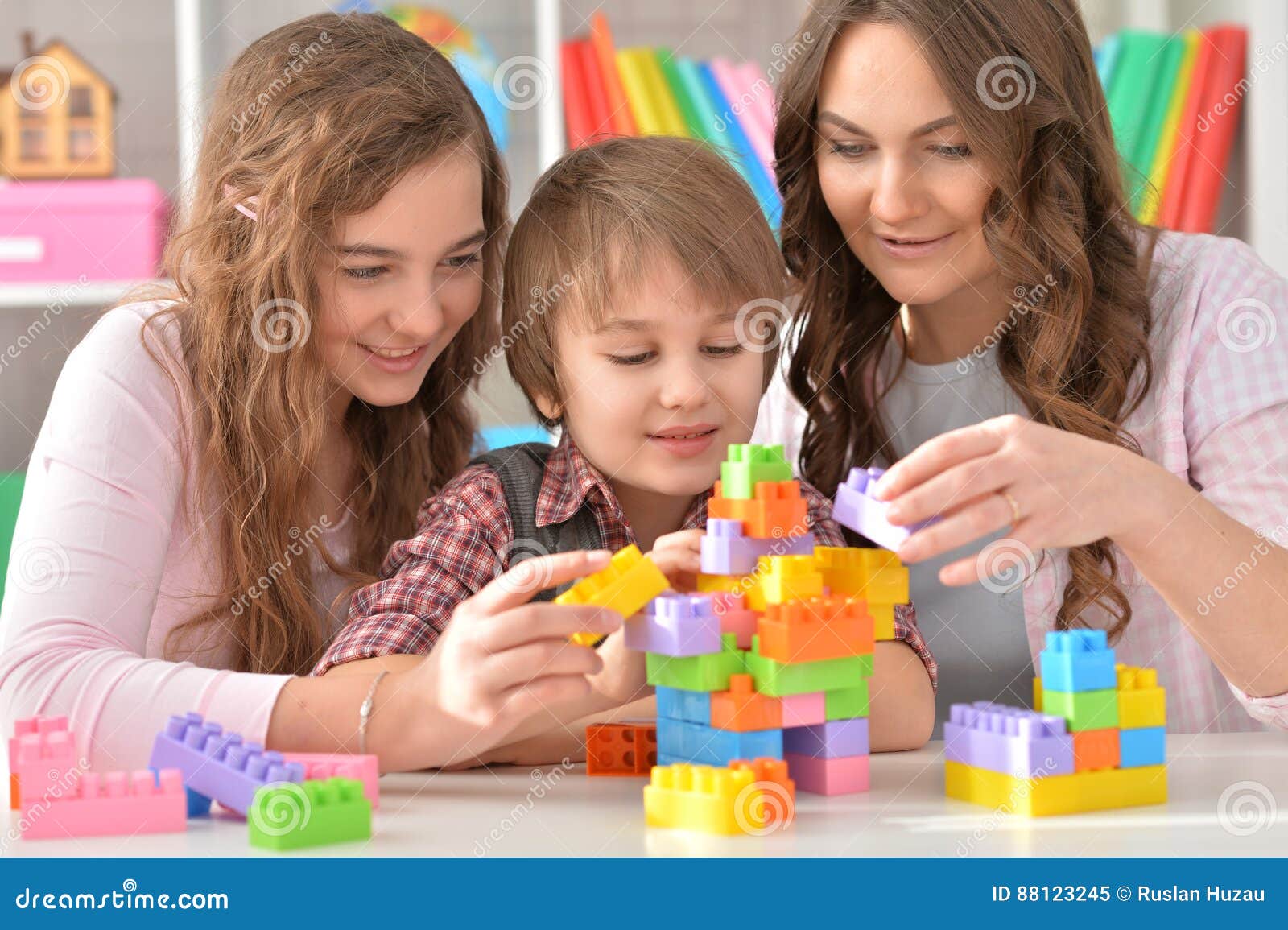 Family playing lego game stock image. Image of playful - 88123245